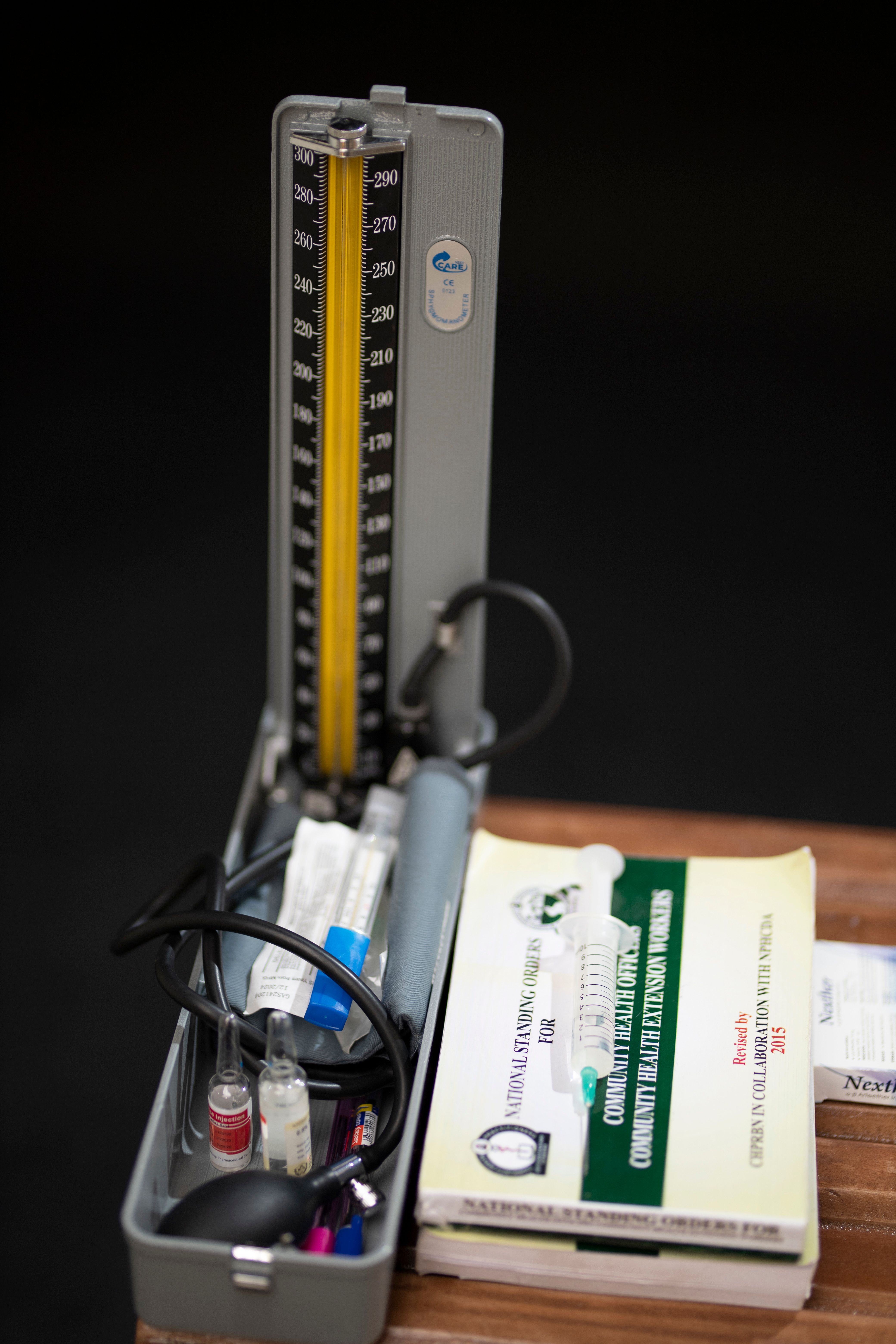 Medical Sphygmomanometer and Textbook Display · Free Stock Photo