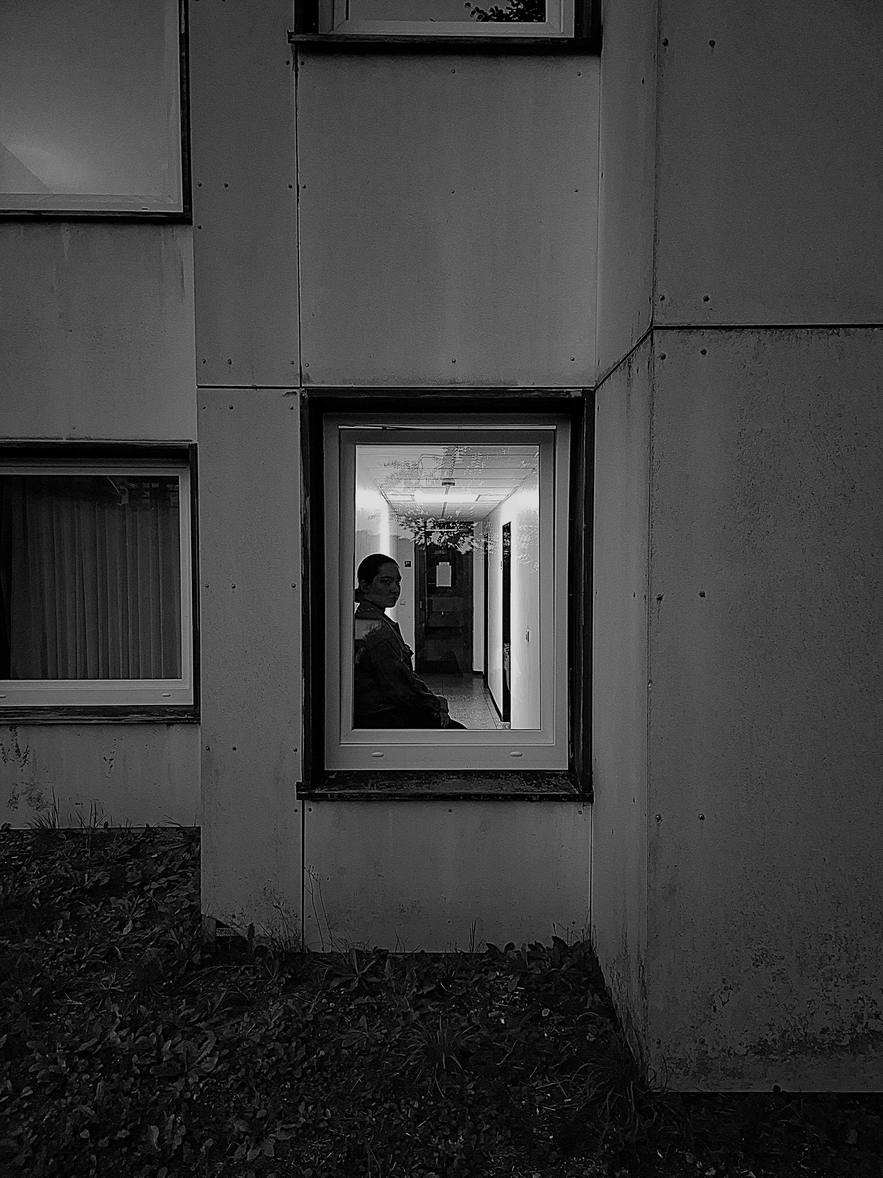 Moody Interior View Through Modern Window · Free Stock Photo