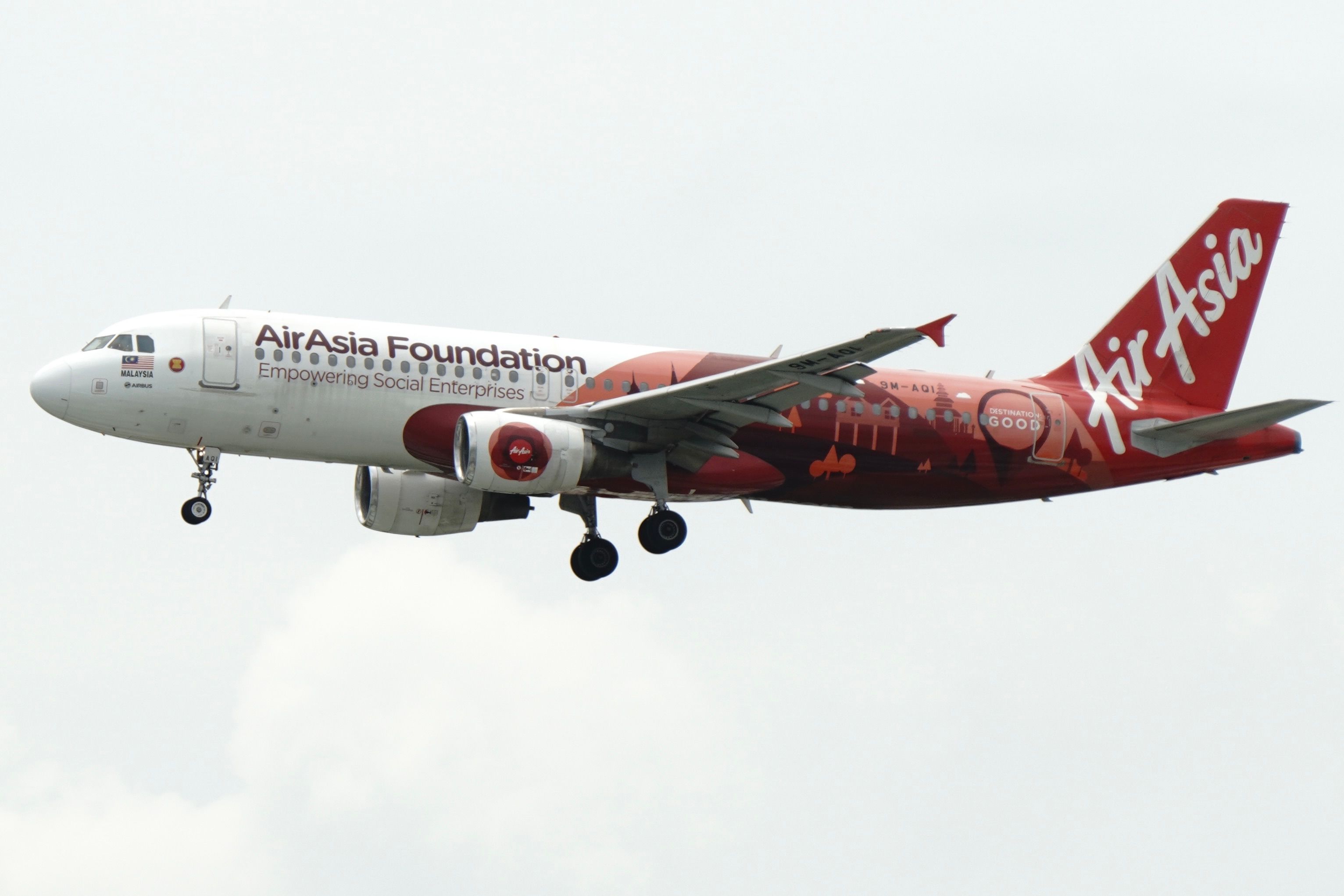 AirAsia Foundation Airbus A320 in Flight · Free Stock Photo