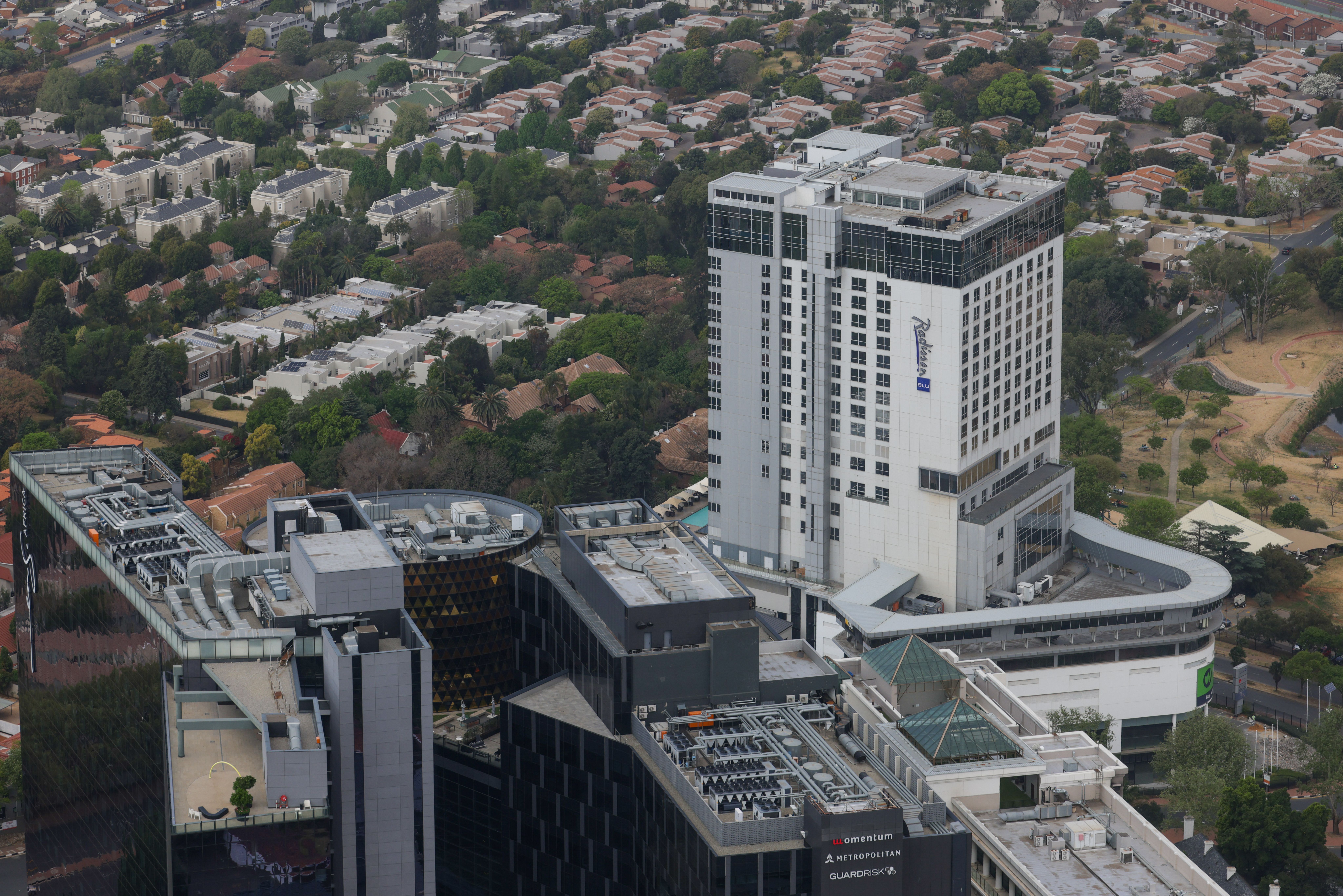 Aerial View of Modern City Buildings and Suburbia · Free Stock Photo