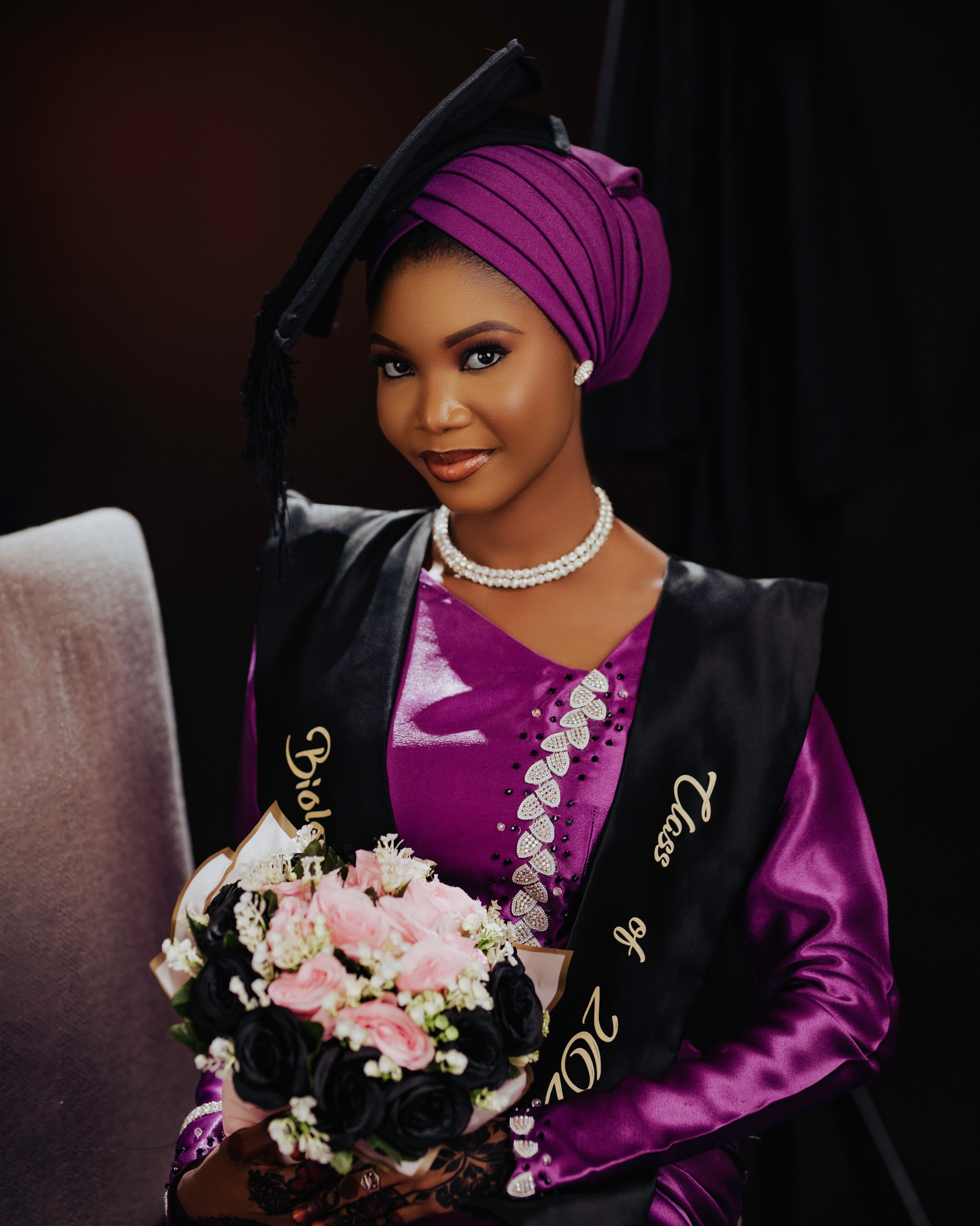 Elegant Female College Graduate in Traditional Attire · Free Stock Photo