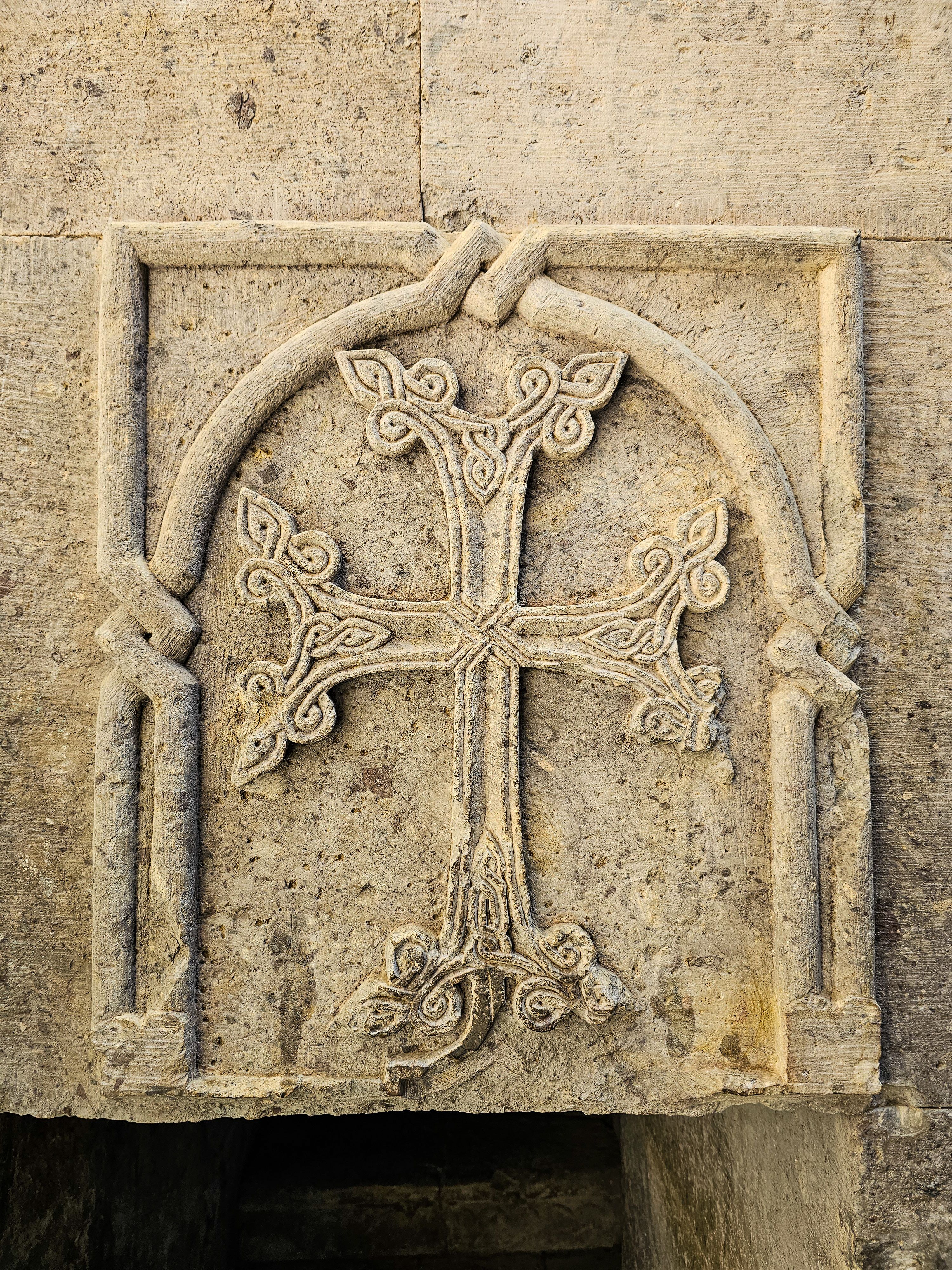 Ornate Stone Cross Carving on Historic Architecture · Free Stock Photo