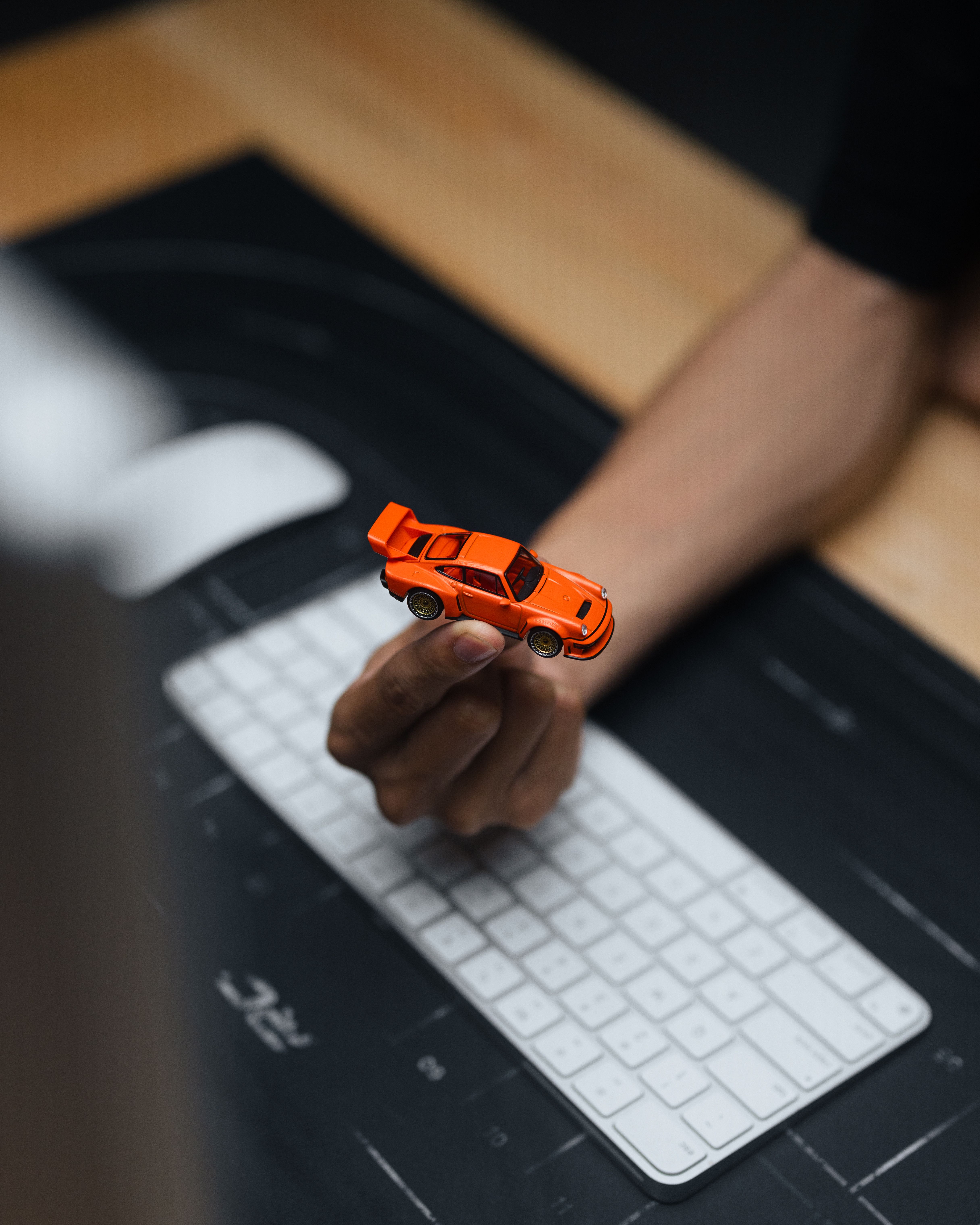 Minimalist Tech Setup with Diecast Car Display · Free Stock Photo