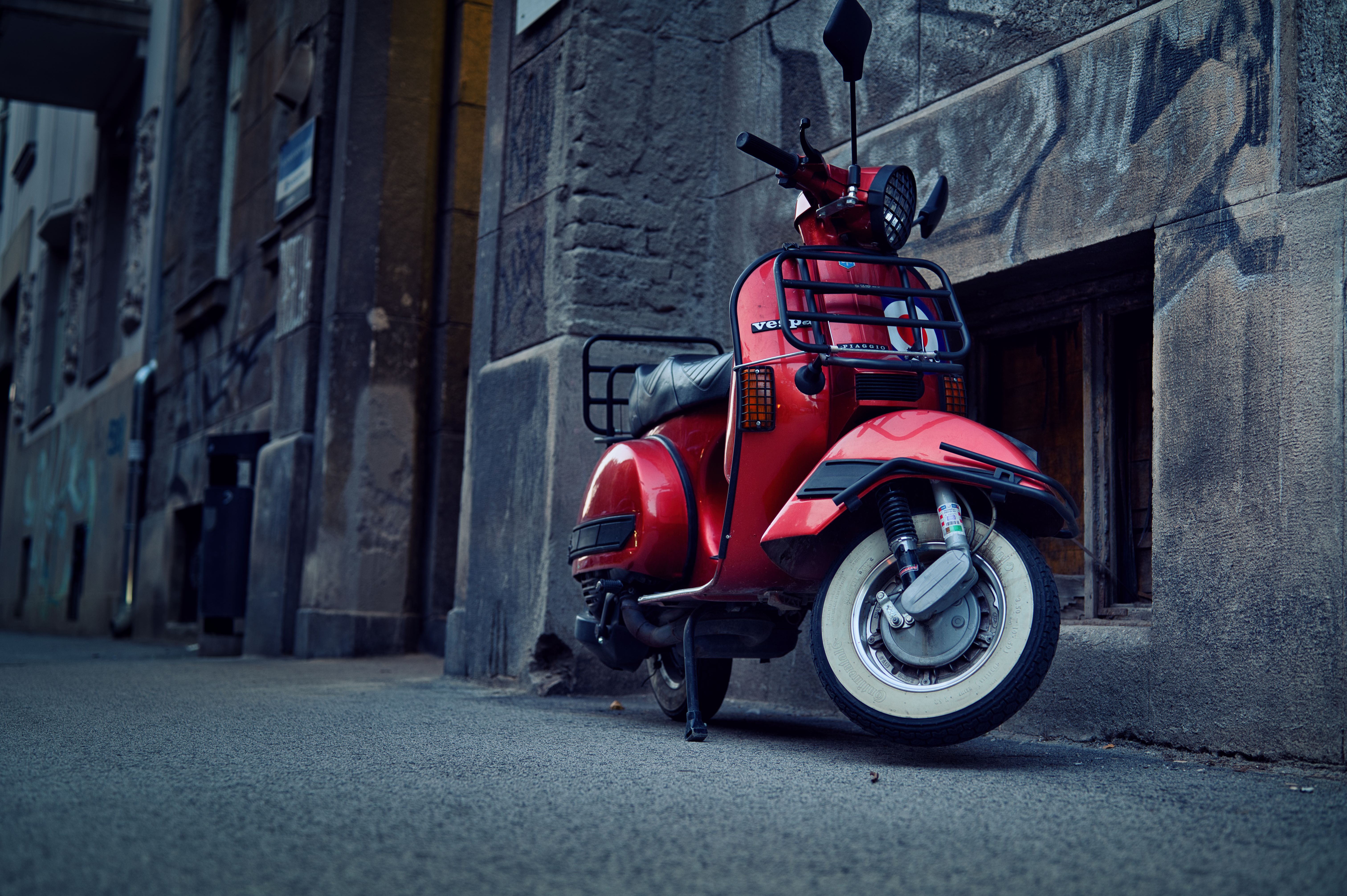 Vintage Red Scooter Parked on Urban Street · Free Stock Photo