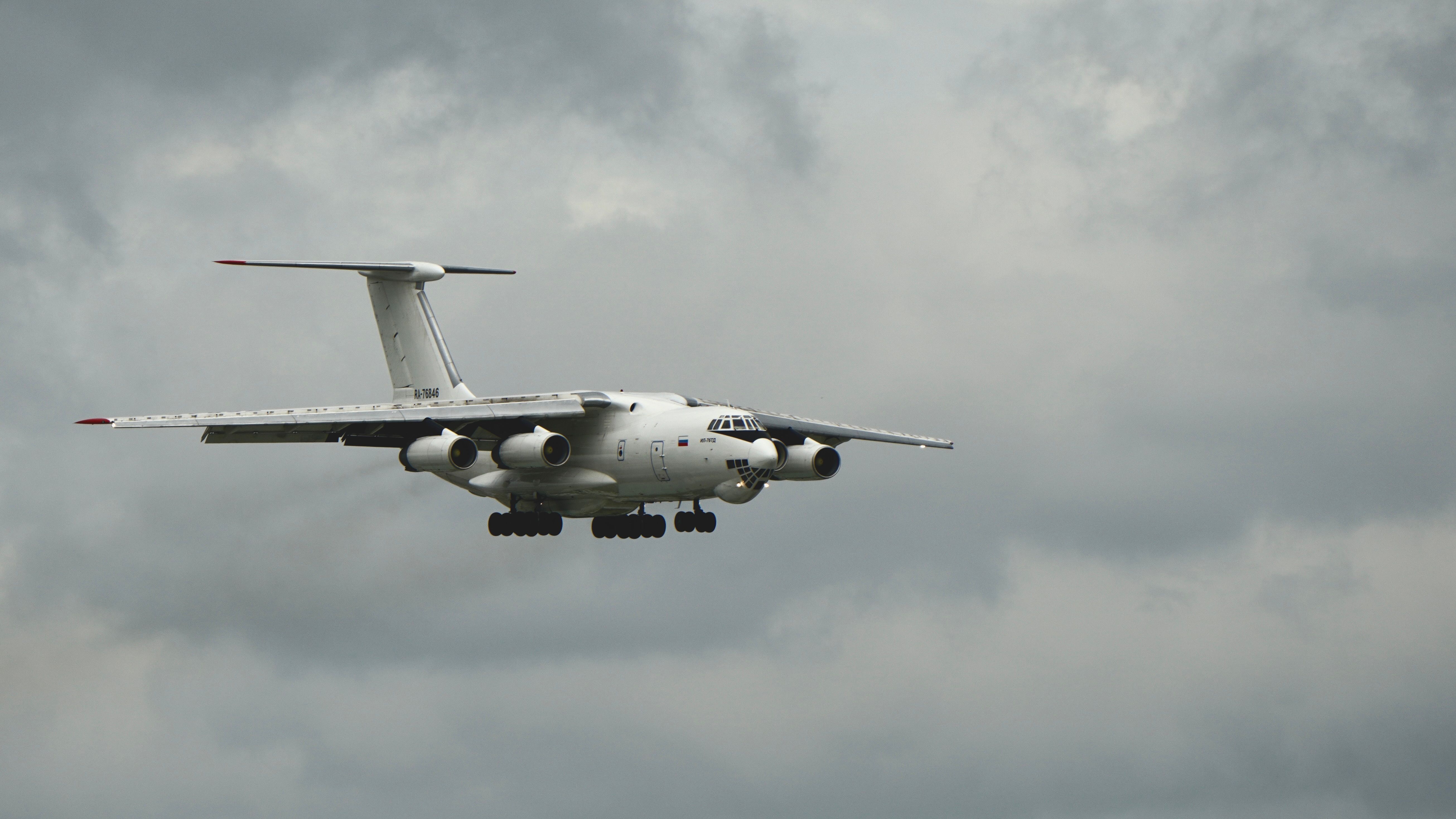 Large Cargo Aircraft in Flight Against Cloudy Sky · Free Stock Photo
