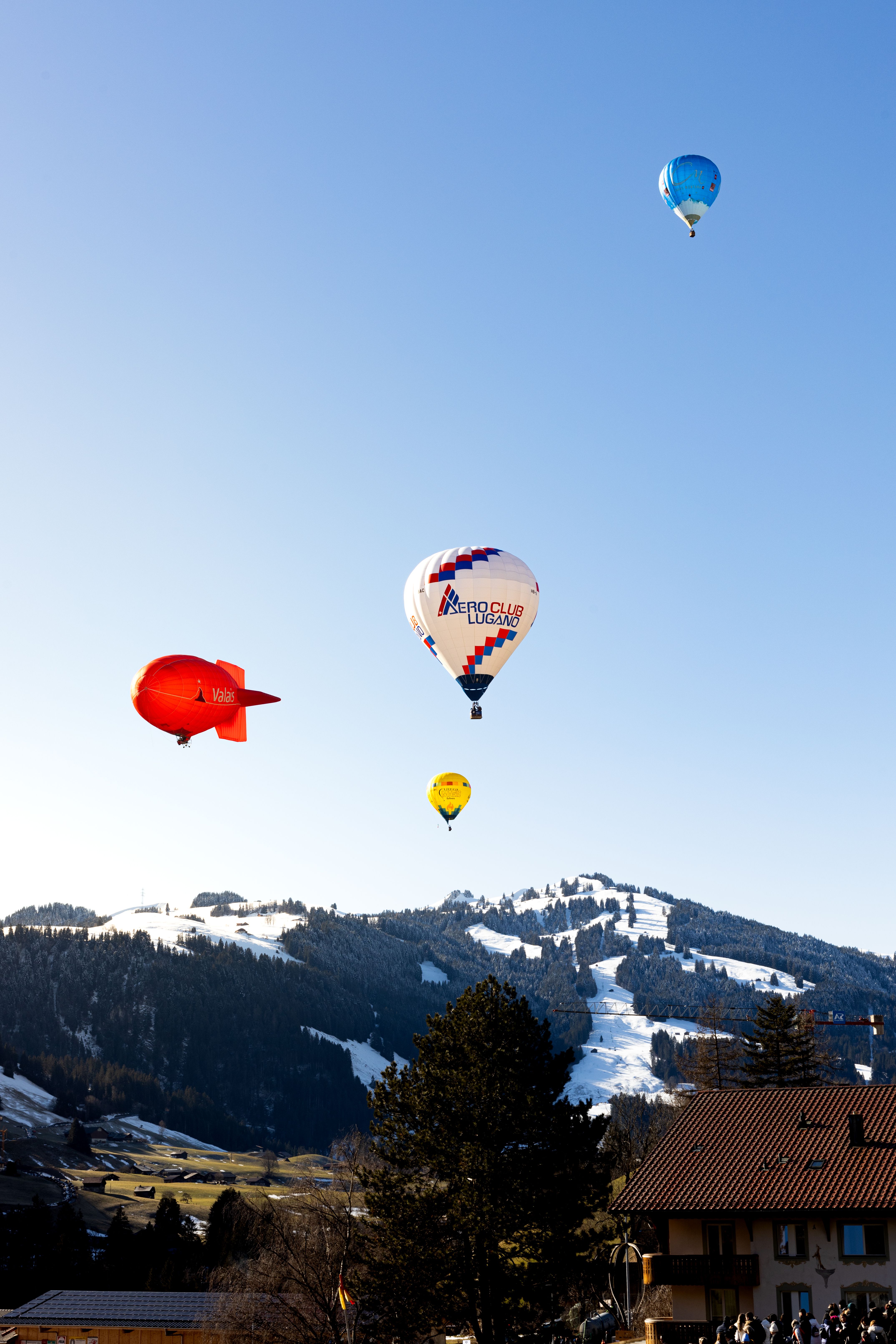 Hot Air Balloons Above Snowy Swiss Alps · Free Stock Photo