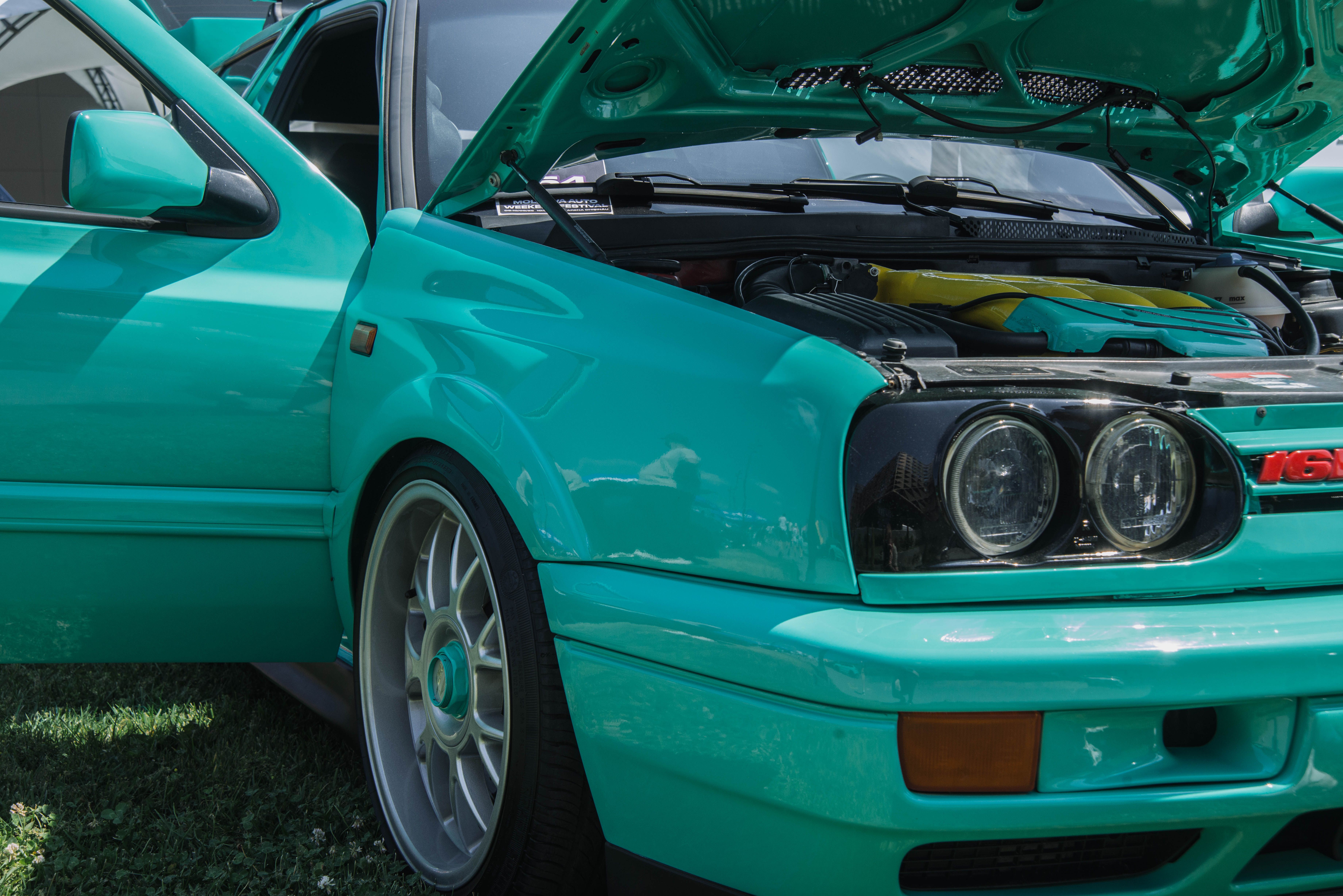 Vibrant Teal Classic Car with Open Hood · Free Stock Photo