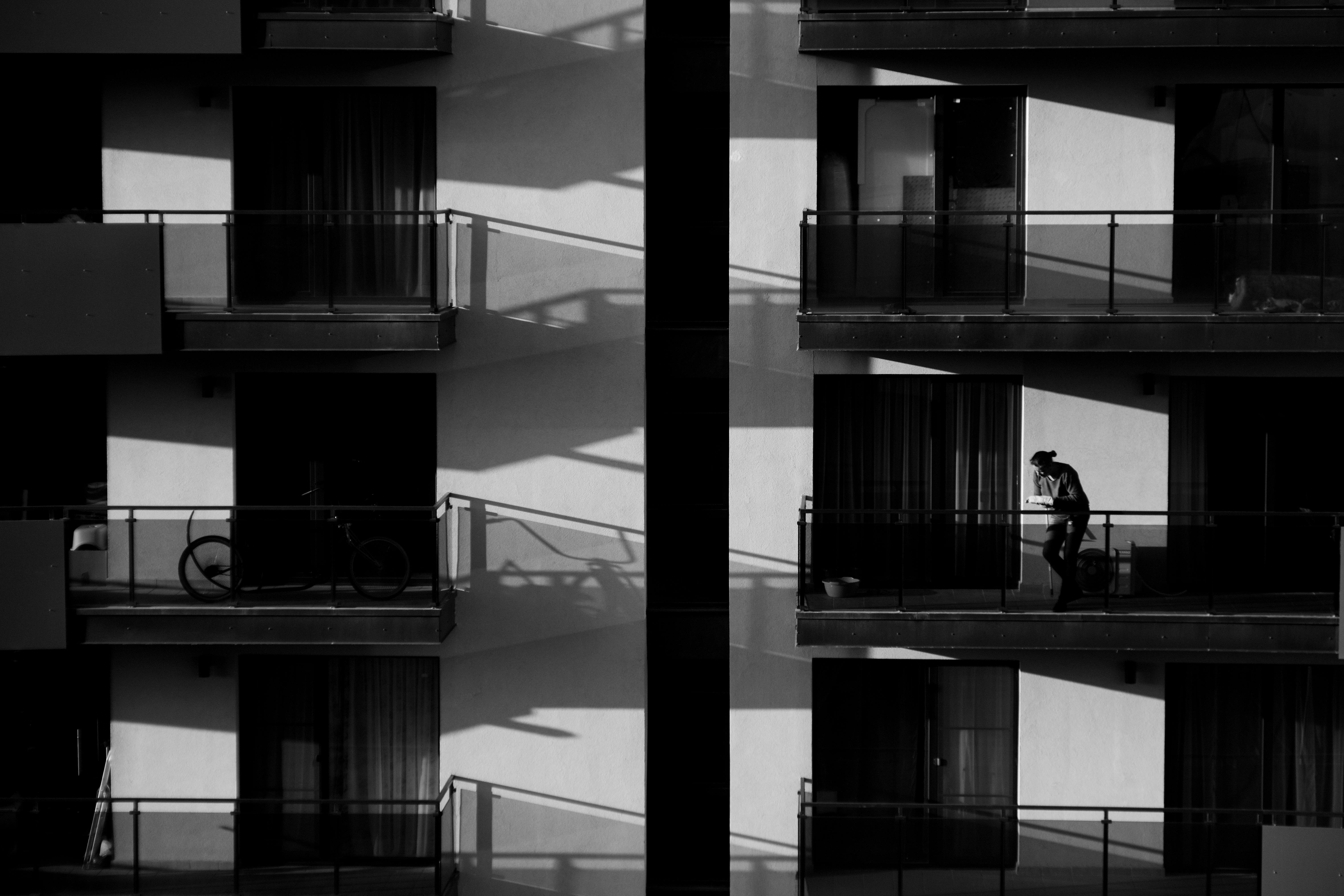 Grayscale Photo Of Three Men Walking Inside Building · Free Stock Photo