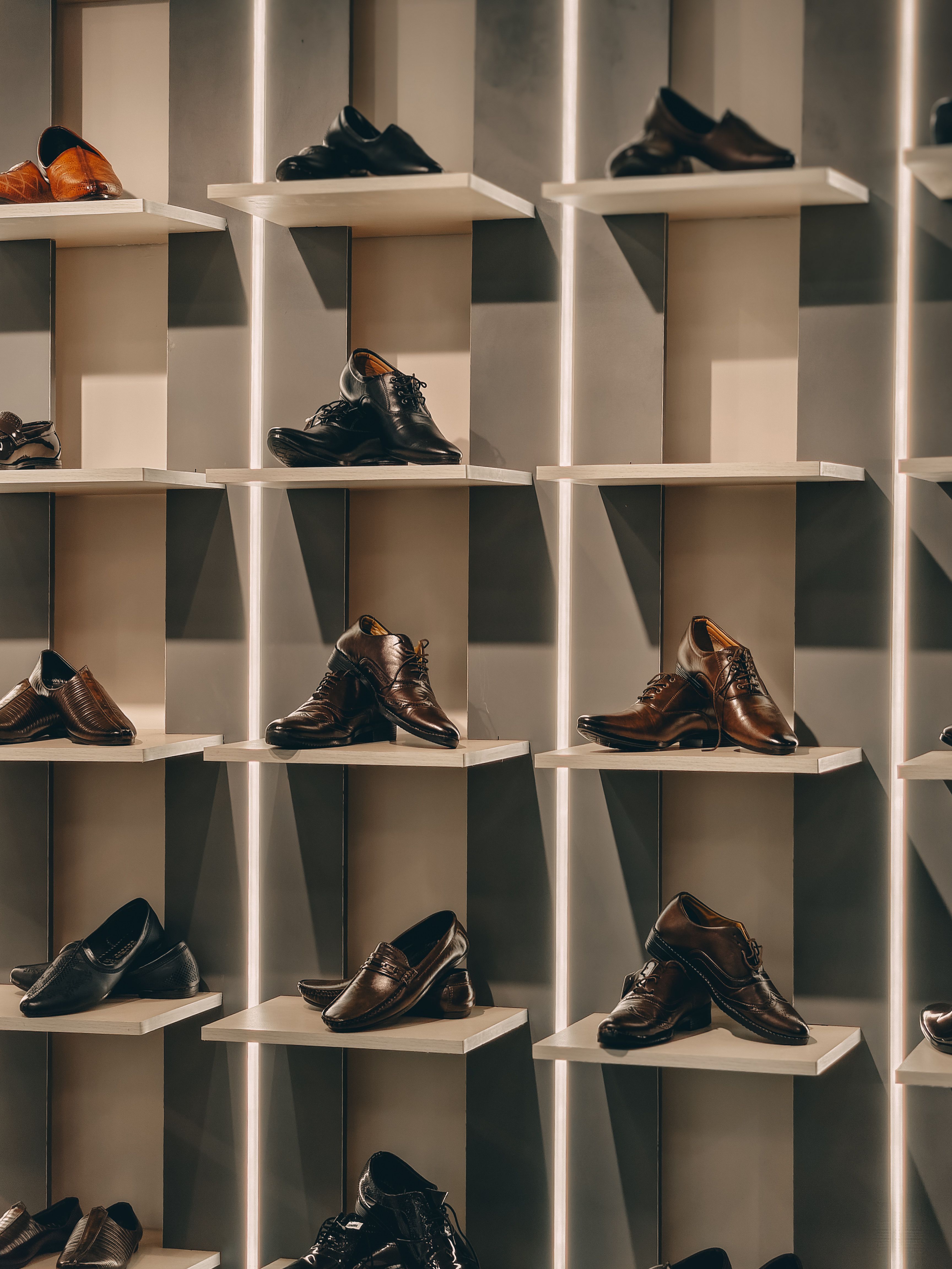 Branded Sneakers on Shelves · Free Stock Photo