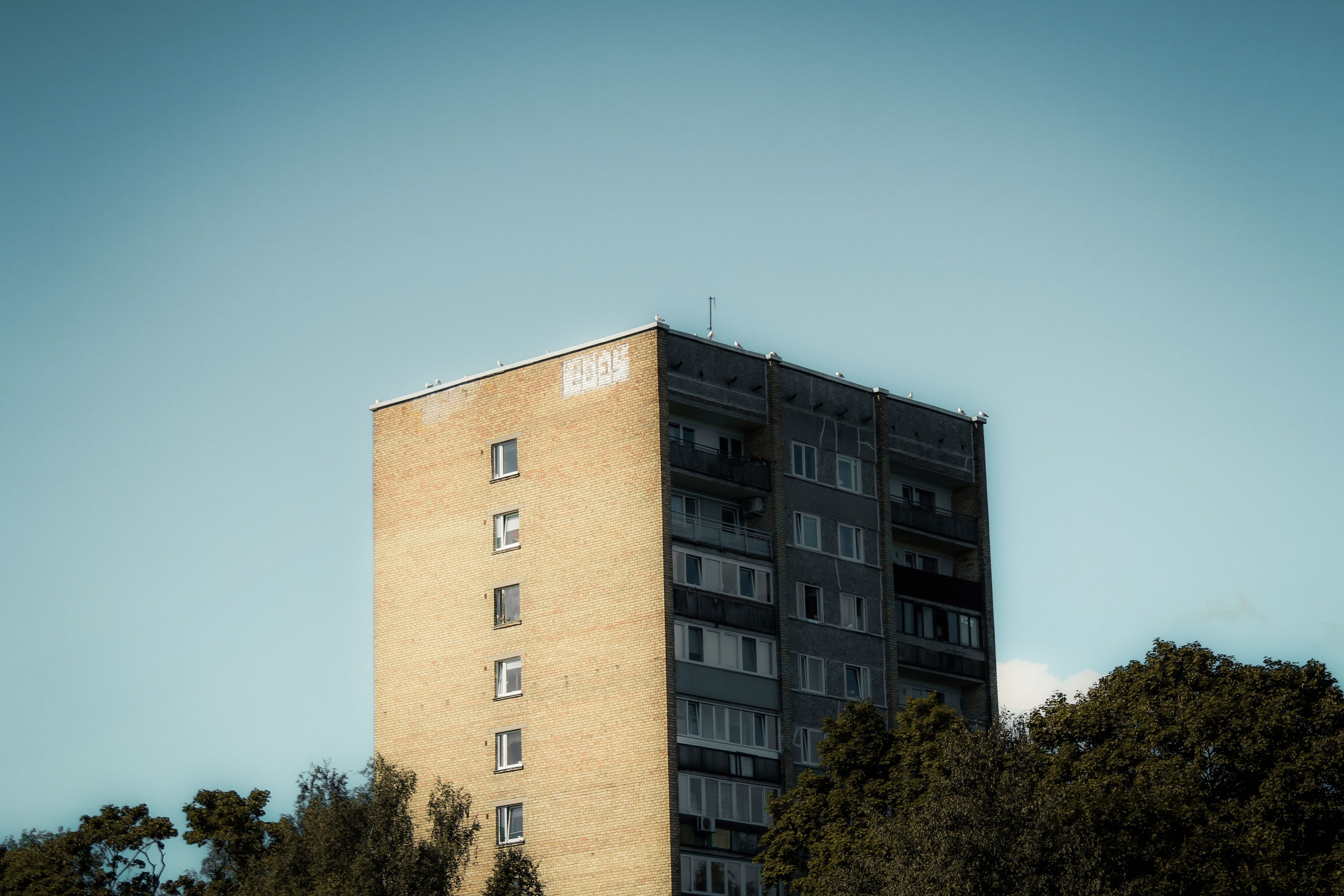Isolated High-Rise Building Against Clear Sky · Free Stock Photo