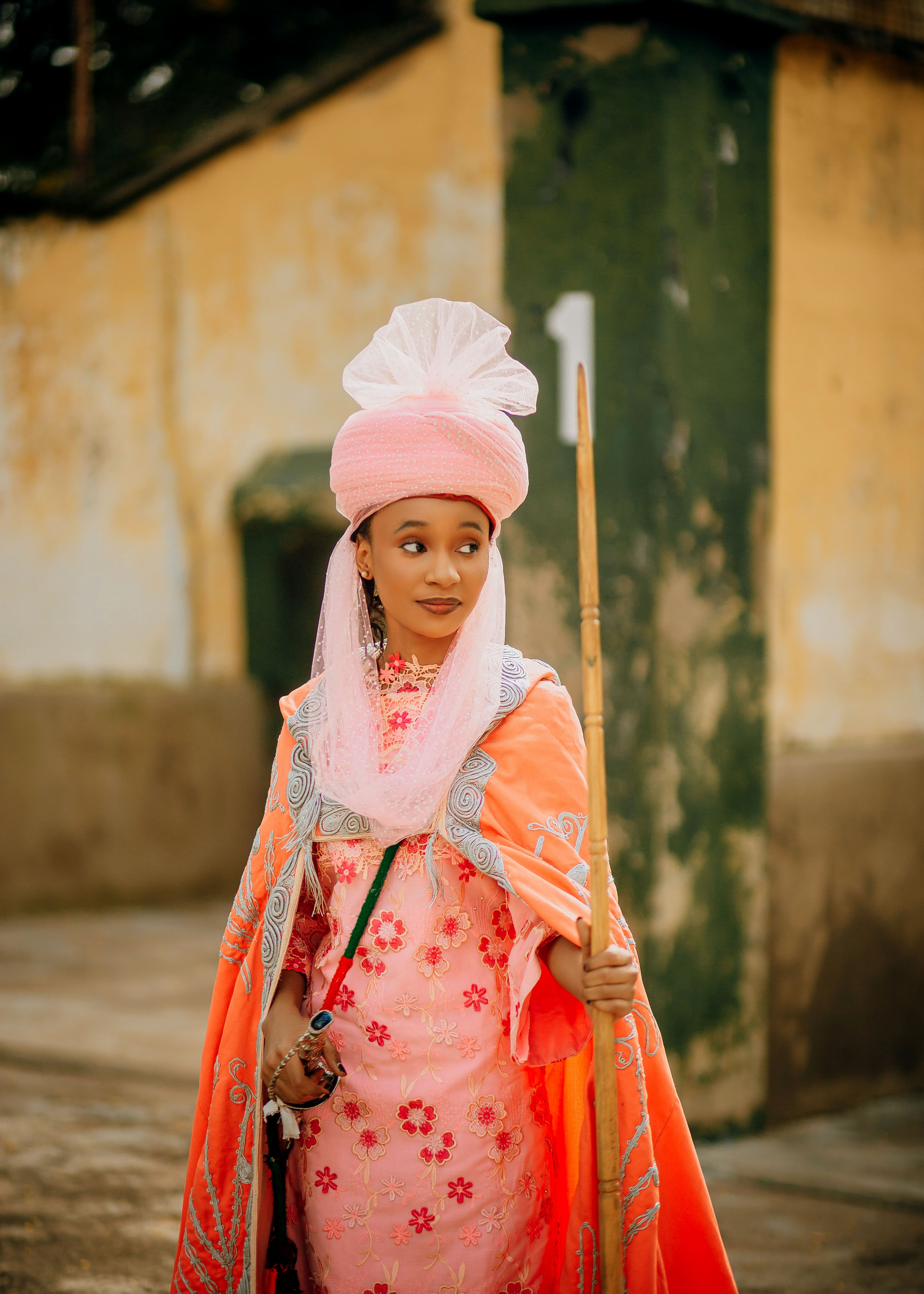 Traditional Nigerian Attire with Ornate Staff · Free Stock Photo