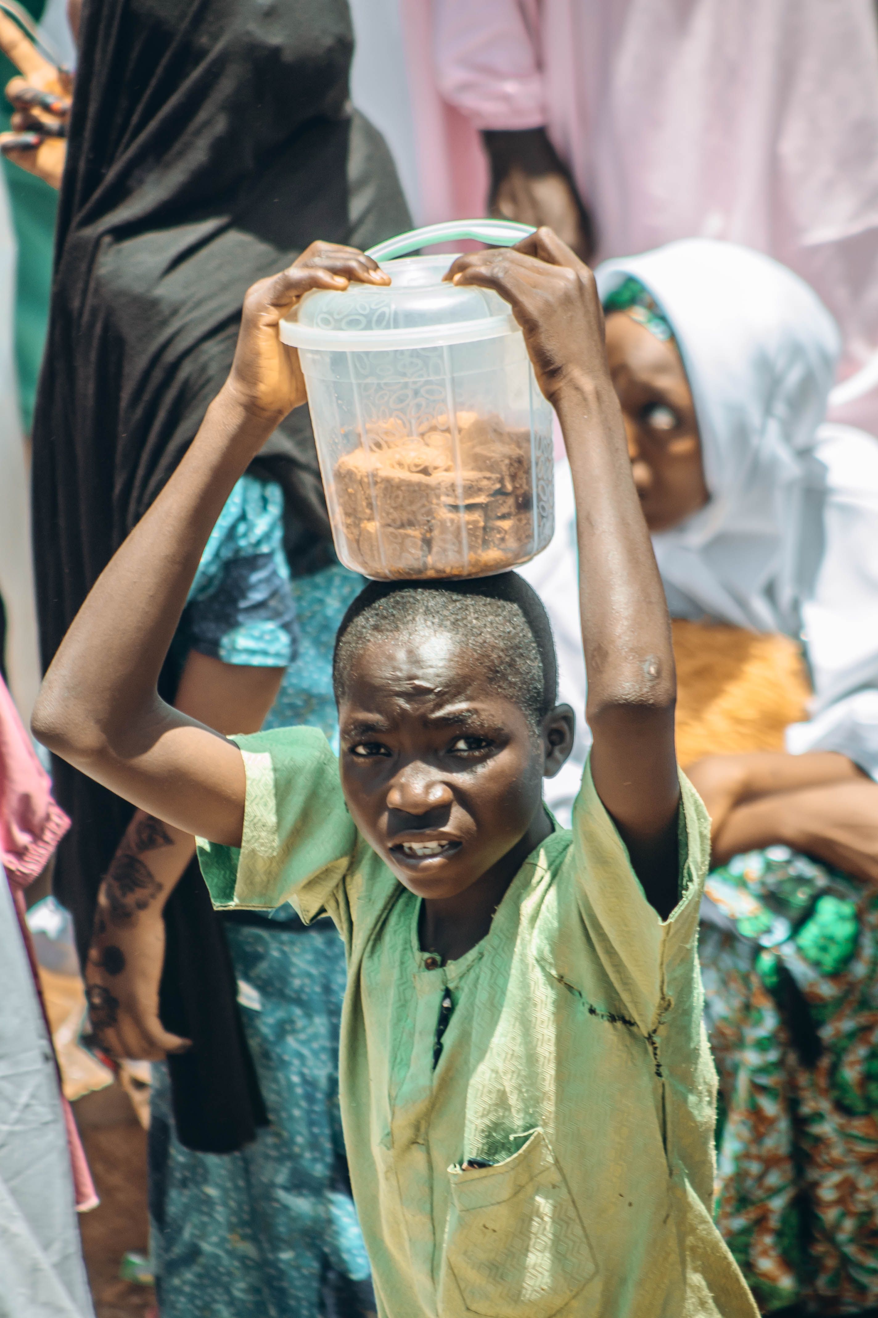 Child Selling Snacks in Traditional Market · Free Stock Photo