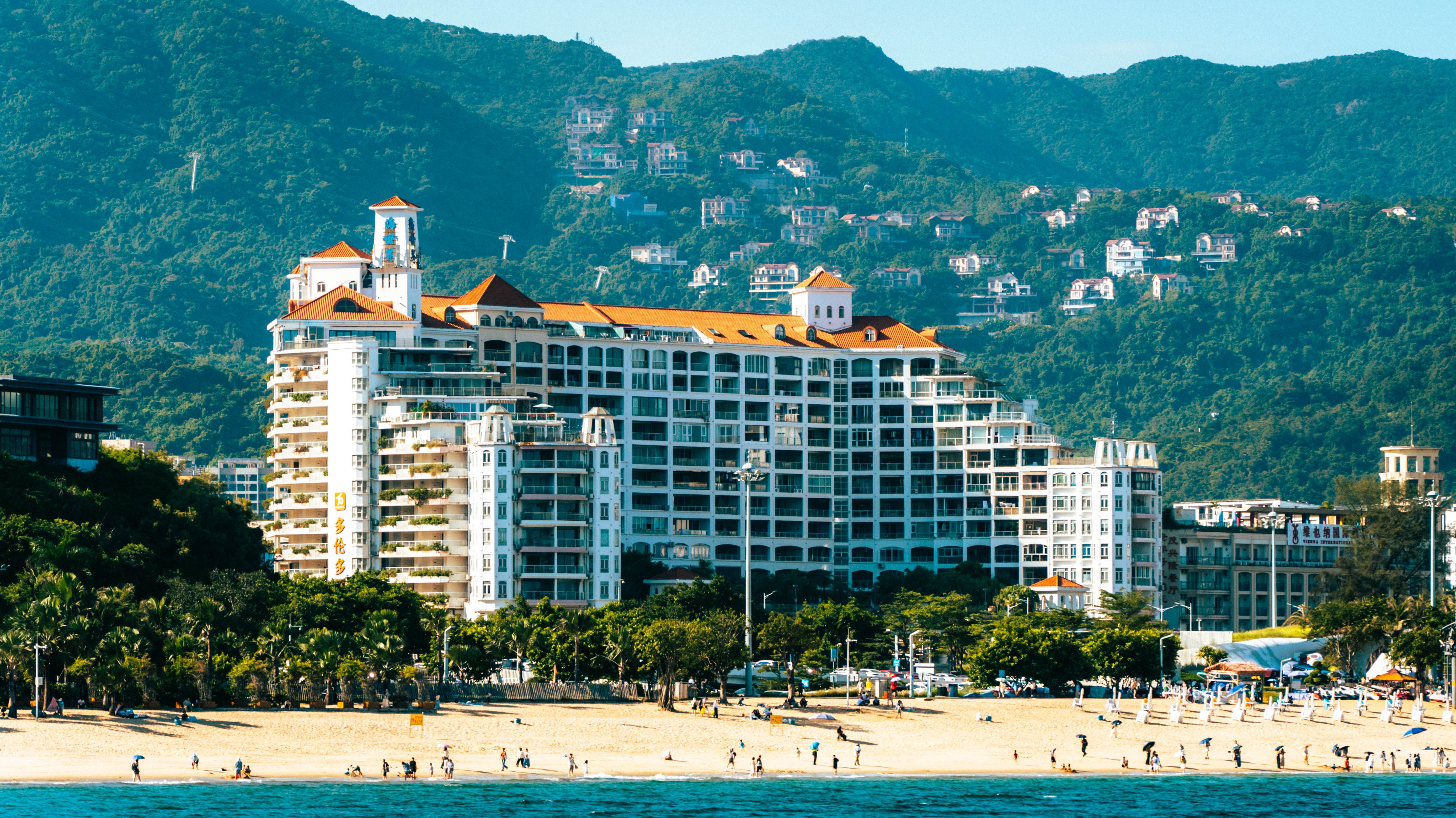 Scenic Beachfront Resort with Mountain View · Free Stock Photo