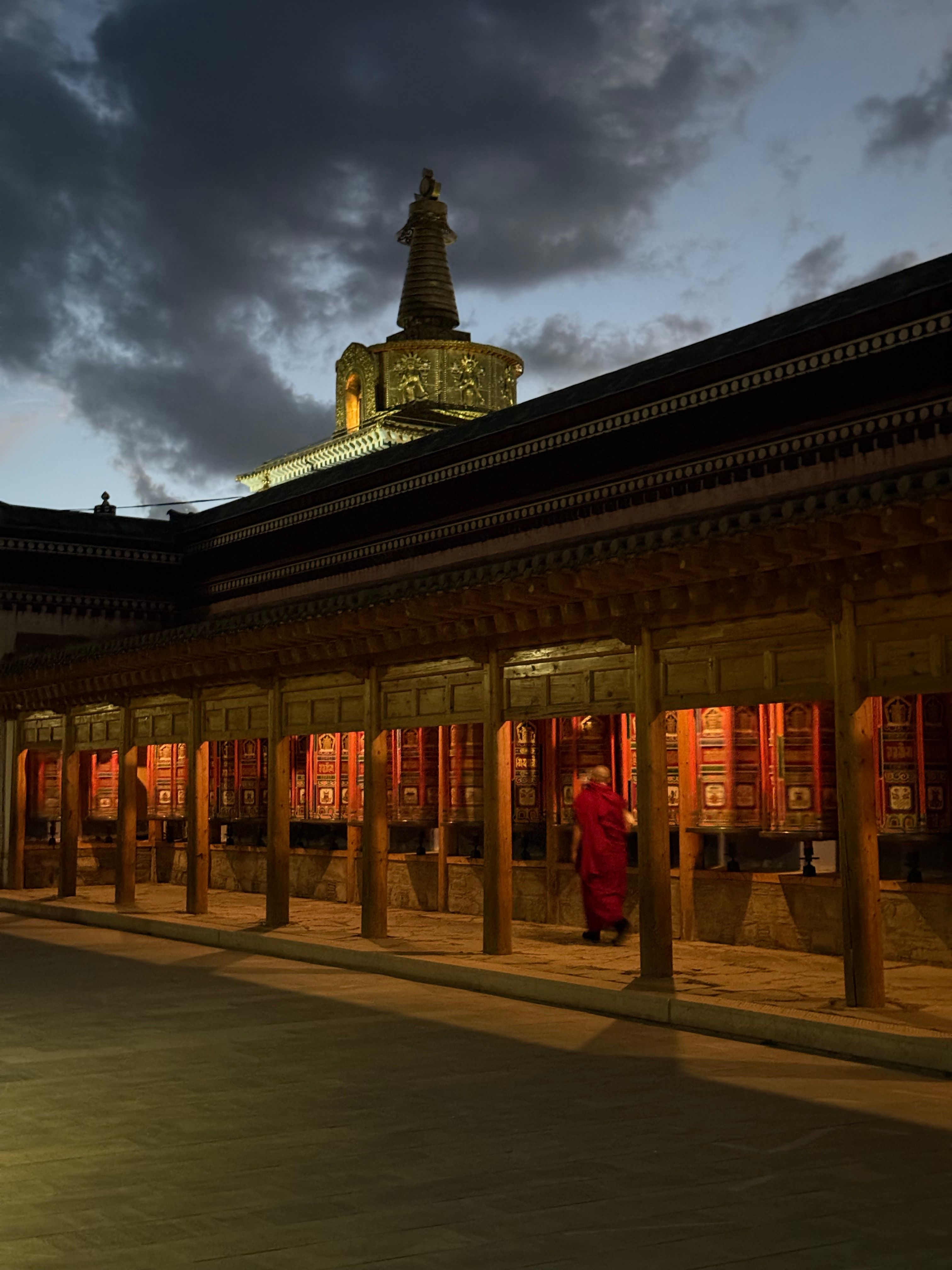Monk Walking at Tibetan Monastery at Dusk · Free Stock Photo