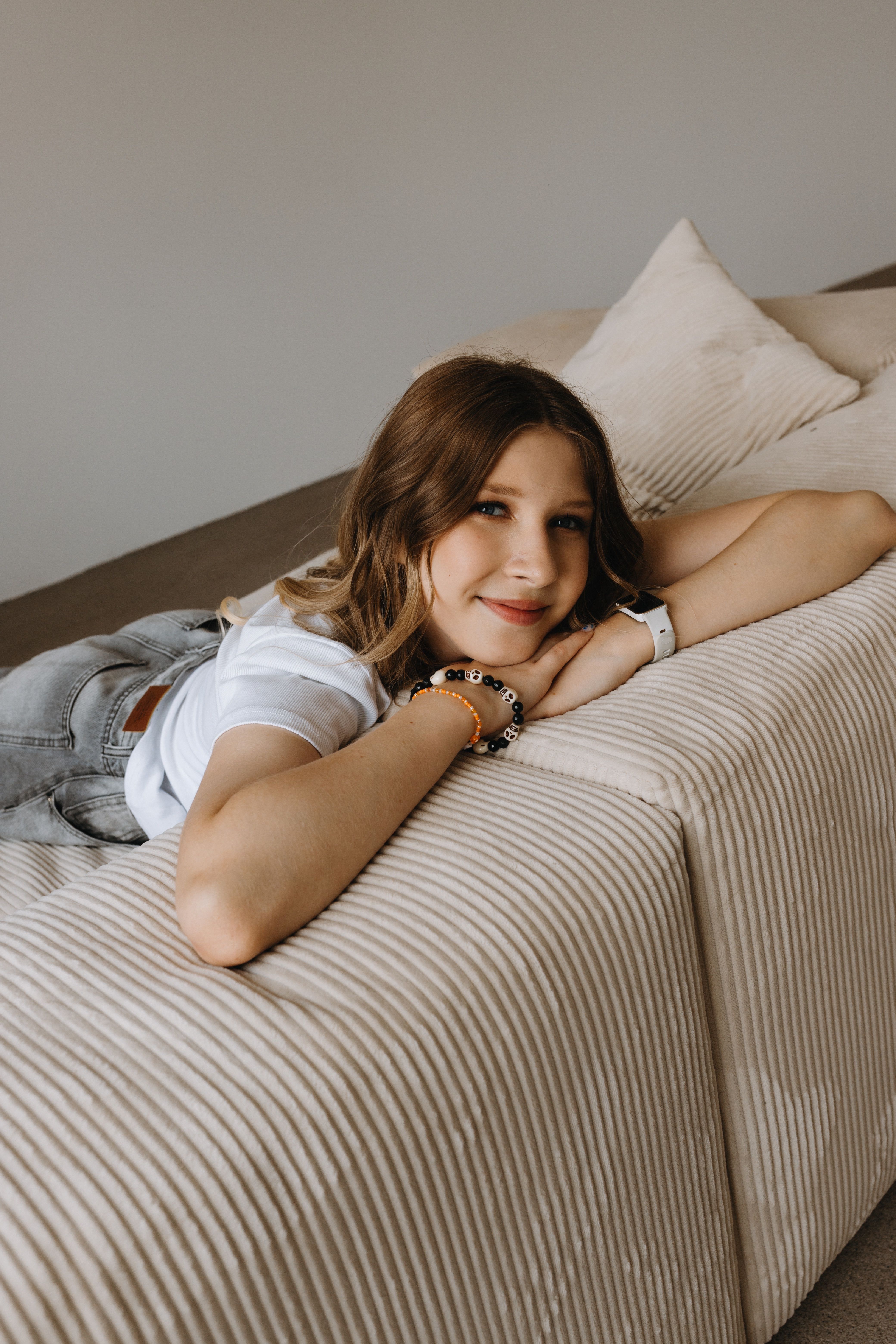 Relaxed Girl Lounging on a Comfortable Sofa · Free Stock Photo