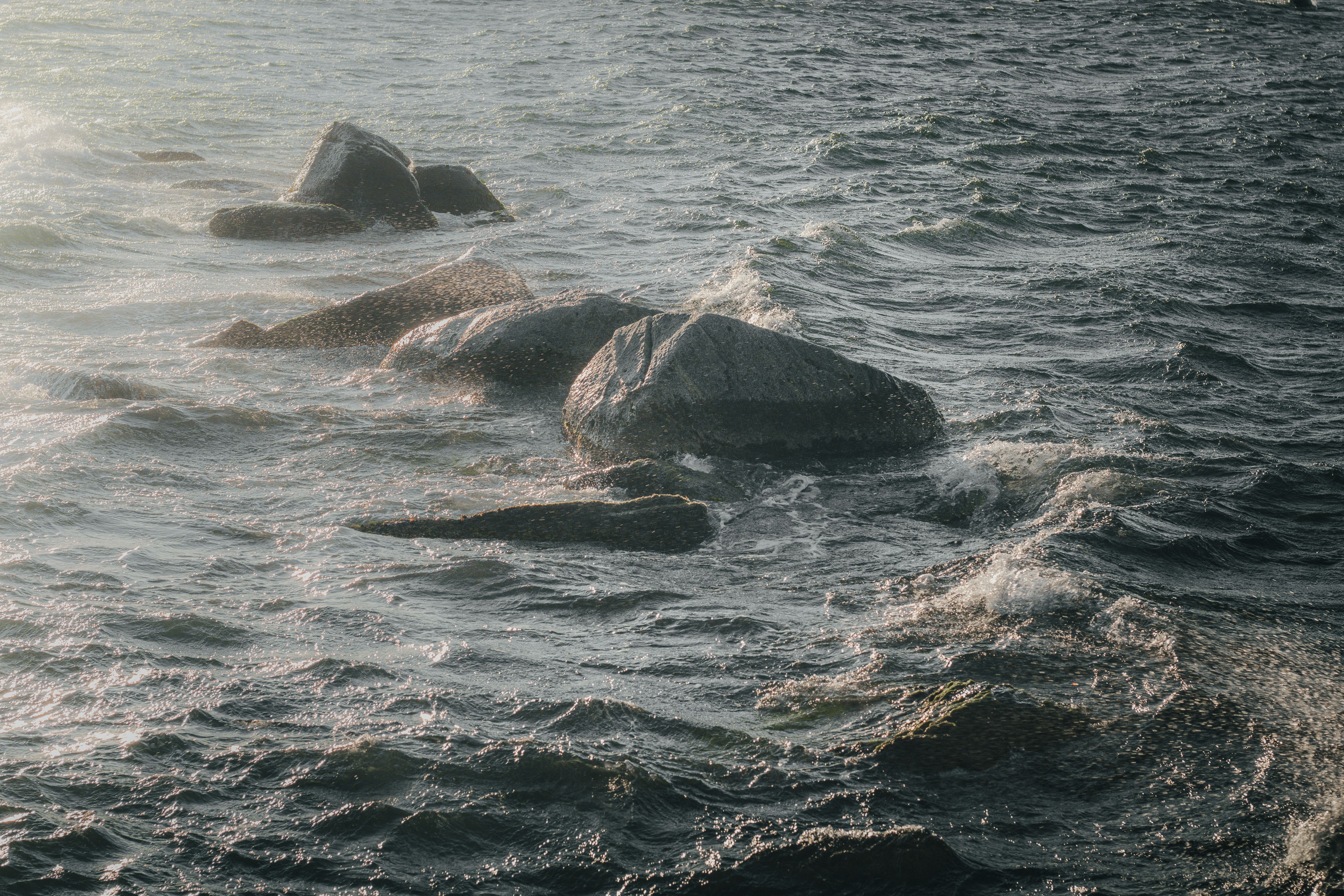 Coastal Rocks in Ocean Waves at Dusk · Free Stock Photo