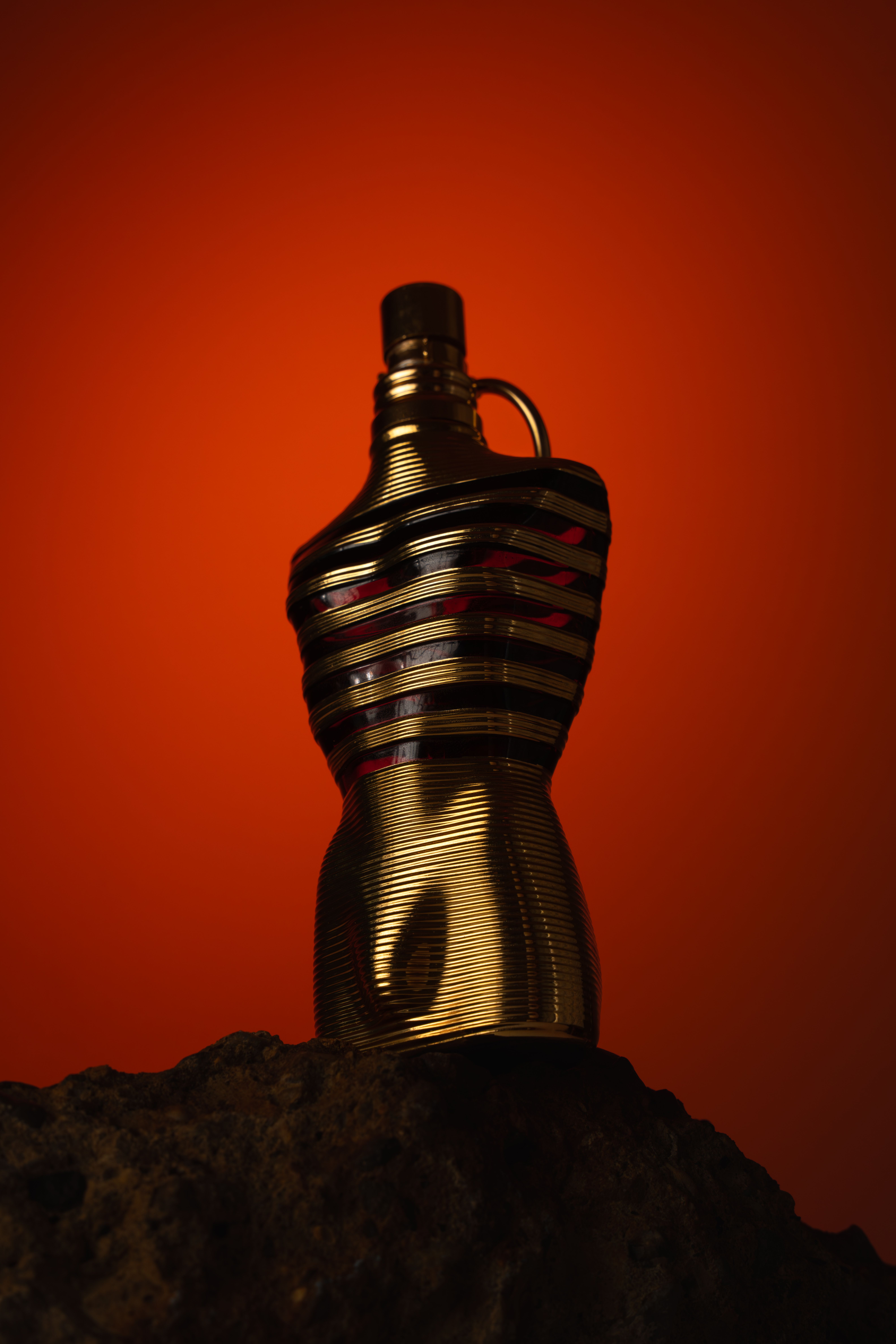 Luxurious Perfume Bottle Against Dramatic Backdrop · Free Stock Photo