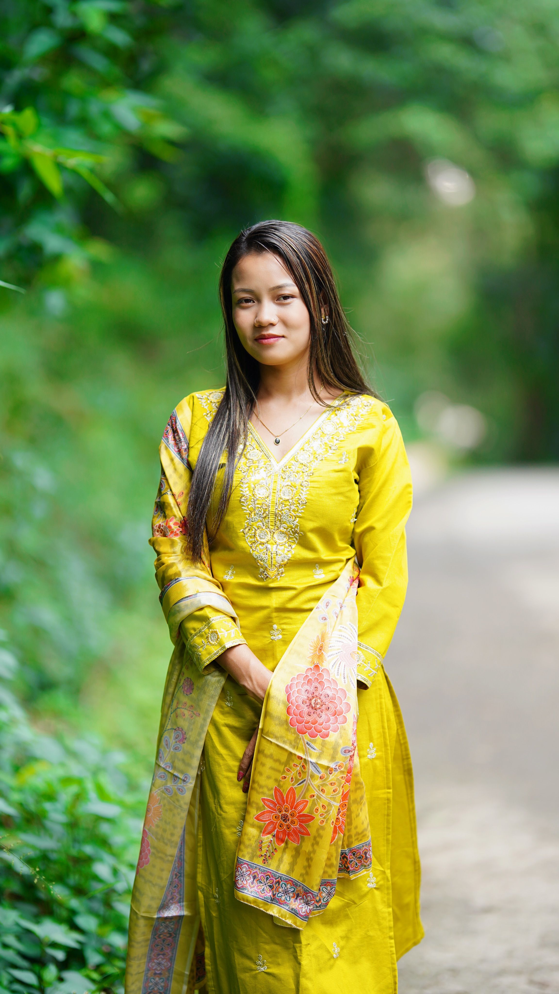 Young Woman in Traditional Yellow Dress Outdoors · Free Stock Photo