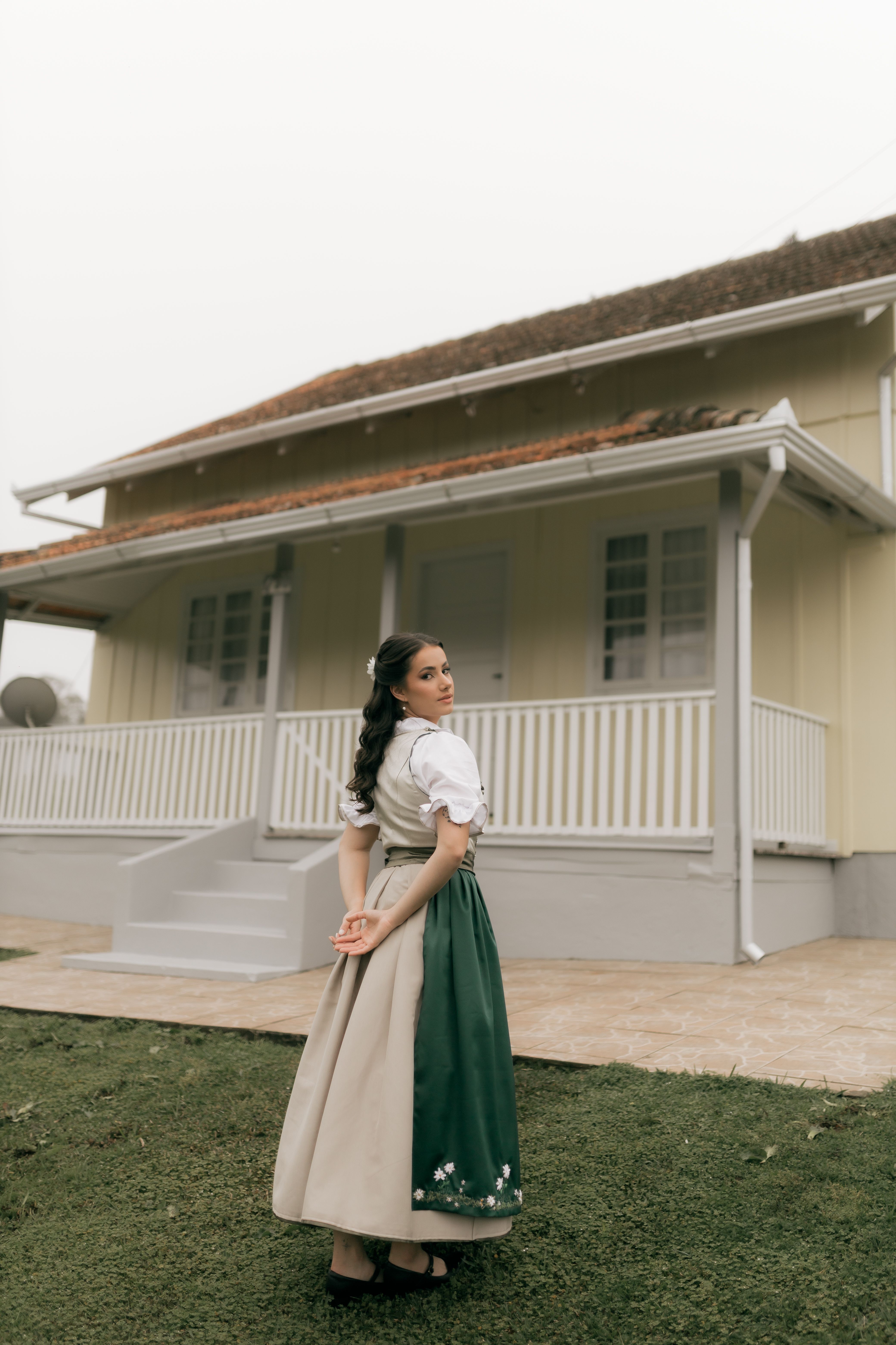 Woman in Traditional Dress Outside a Country House · Free Stock Photo