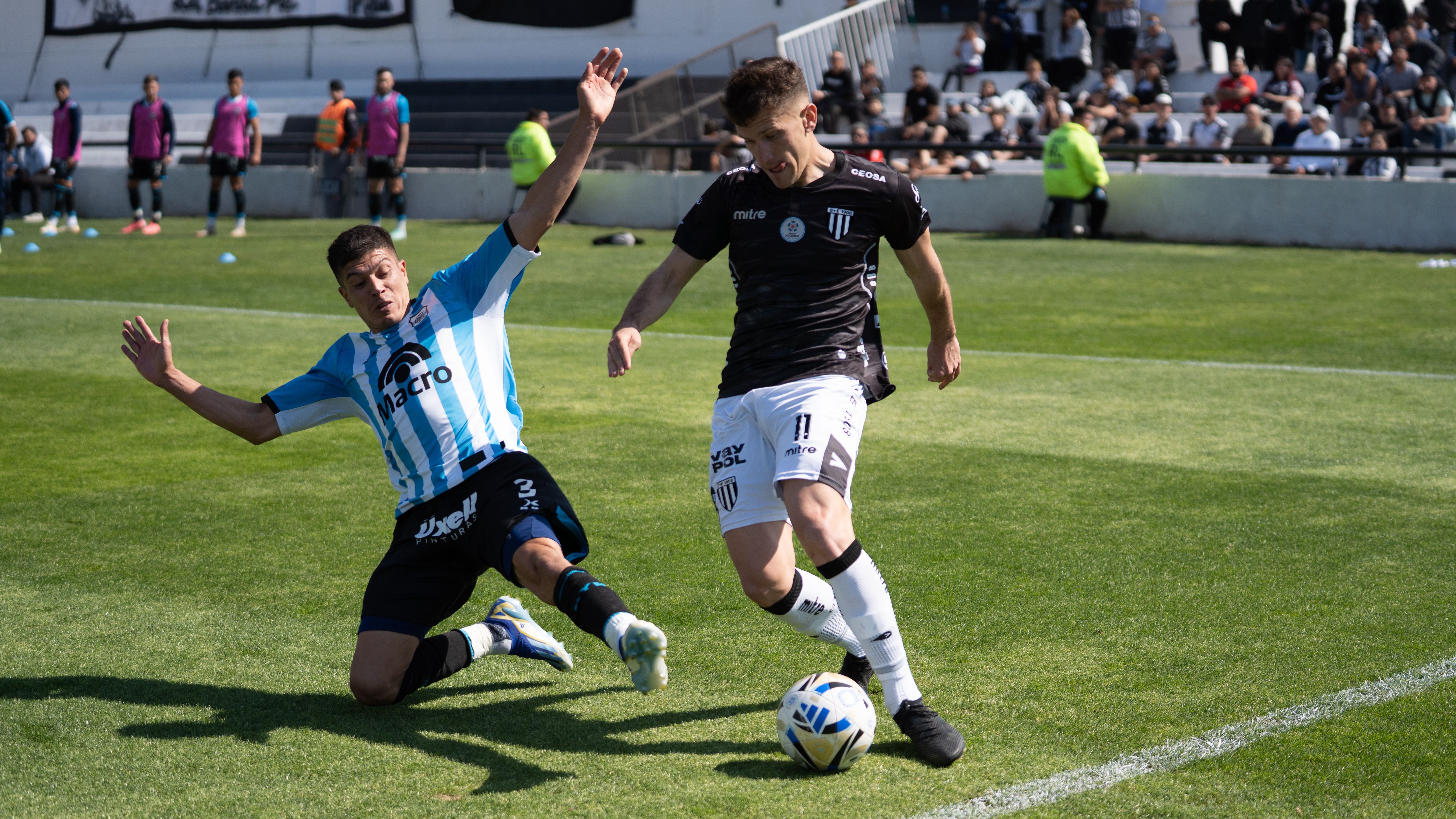 Intense Football Match Action on Sunny Day · Free Stock Photo