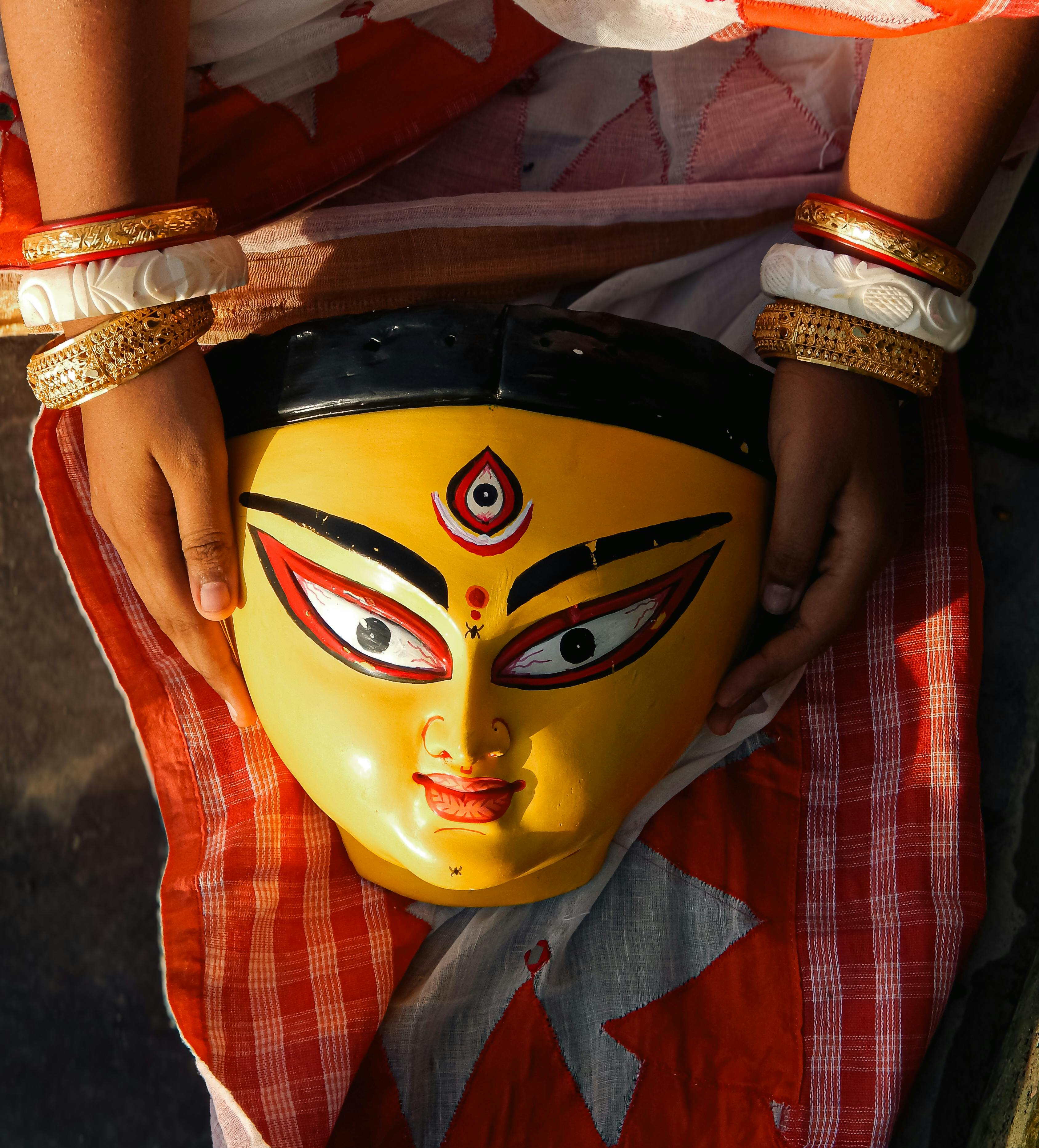 Traditional Indian Mask Held by Woman in Saree · Free Stock Photo