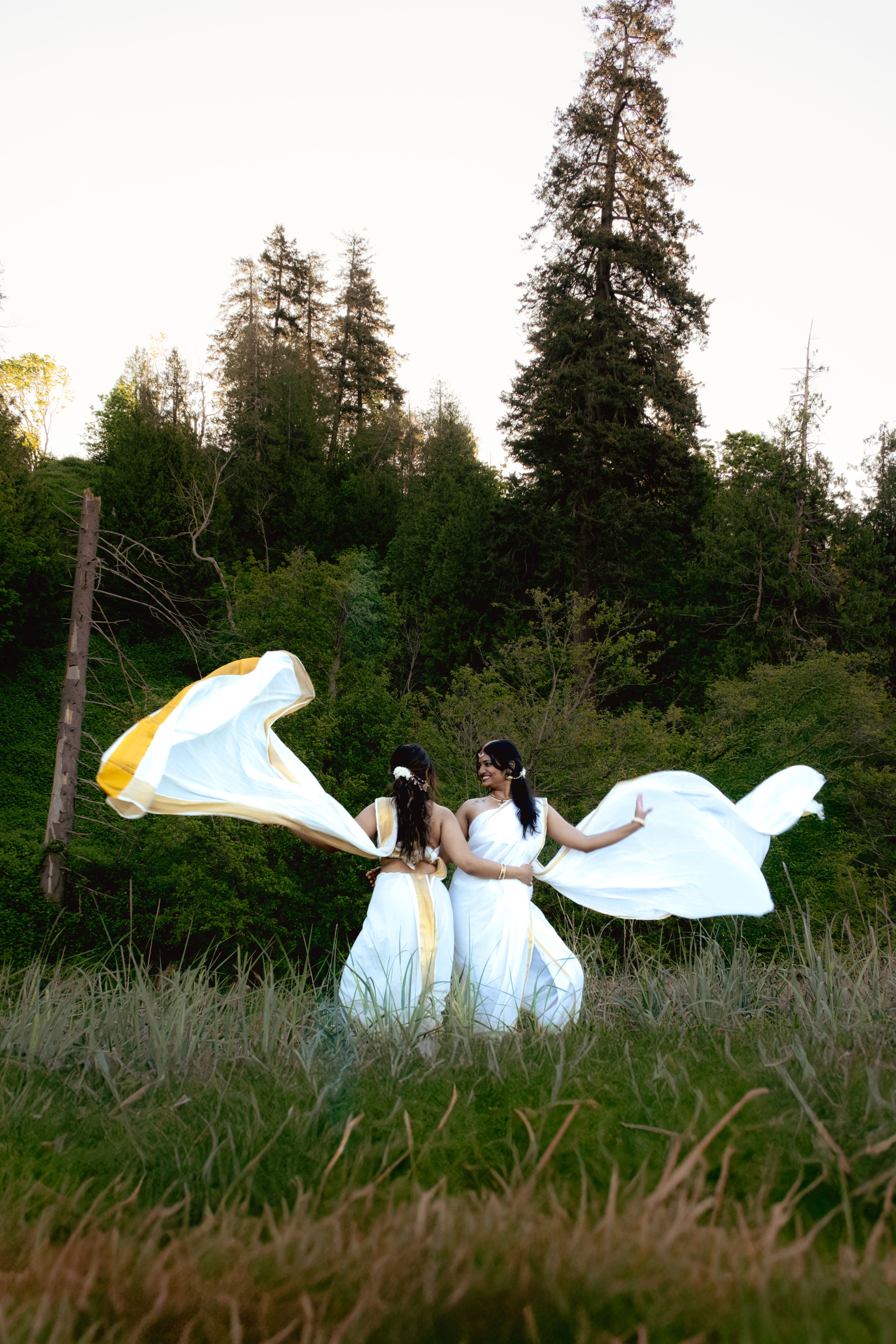 Enchanting Outdoor Portrait of Two Women Dancing · Free Stock Photo