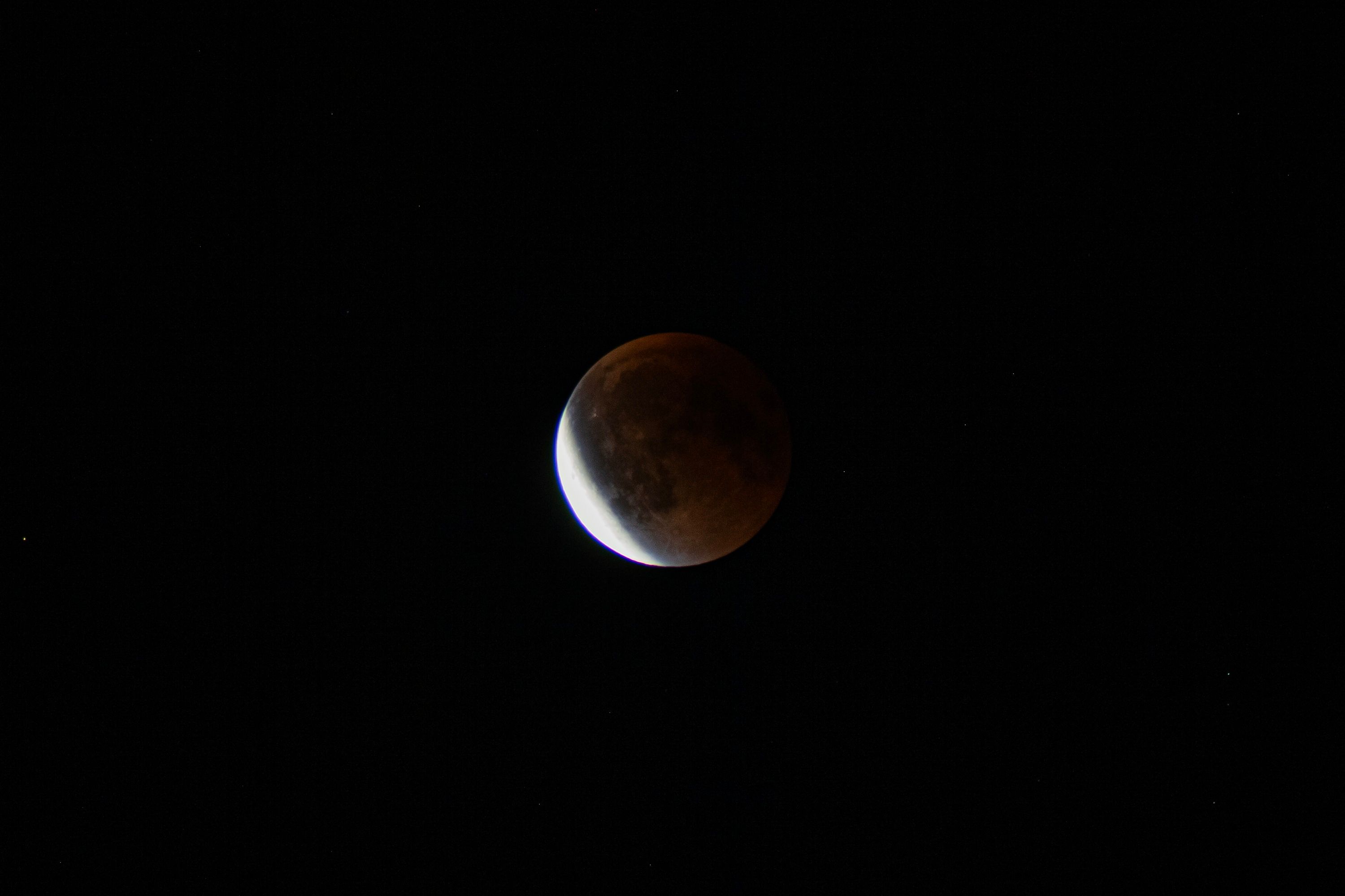 Stunning Lunar Eclipse with Visible Stars · Free Stock Photo