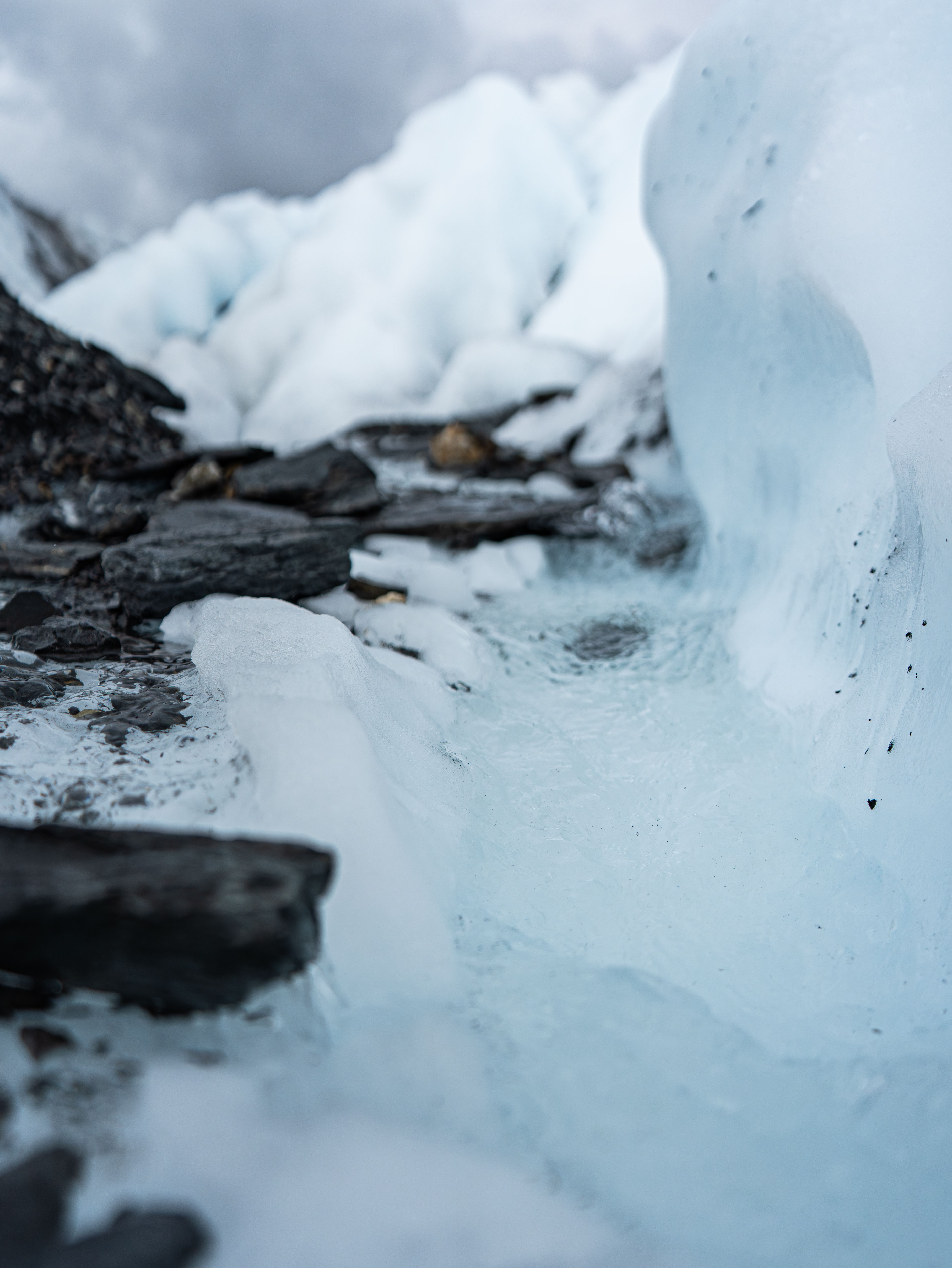Stunning Glacier with Flowing Meltwater Stream · Free Stock Photo