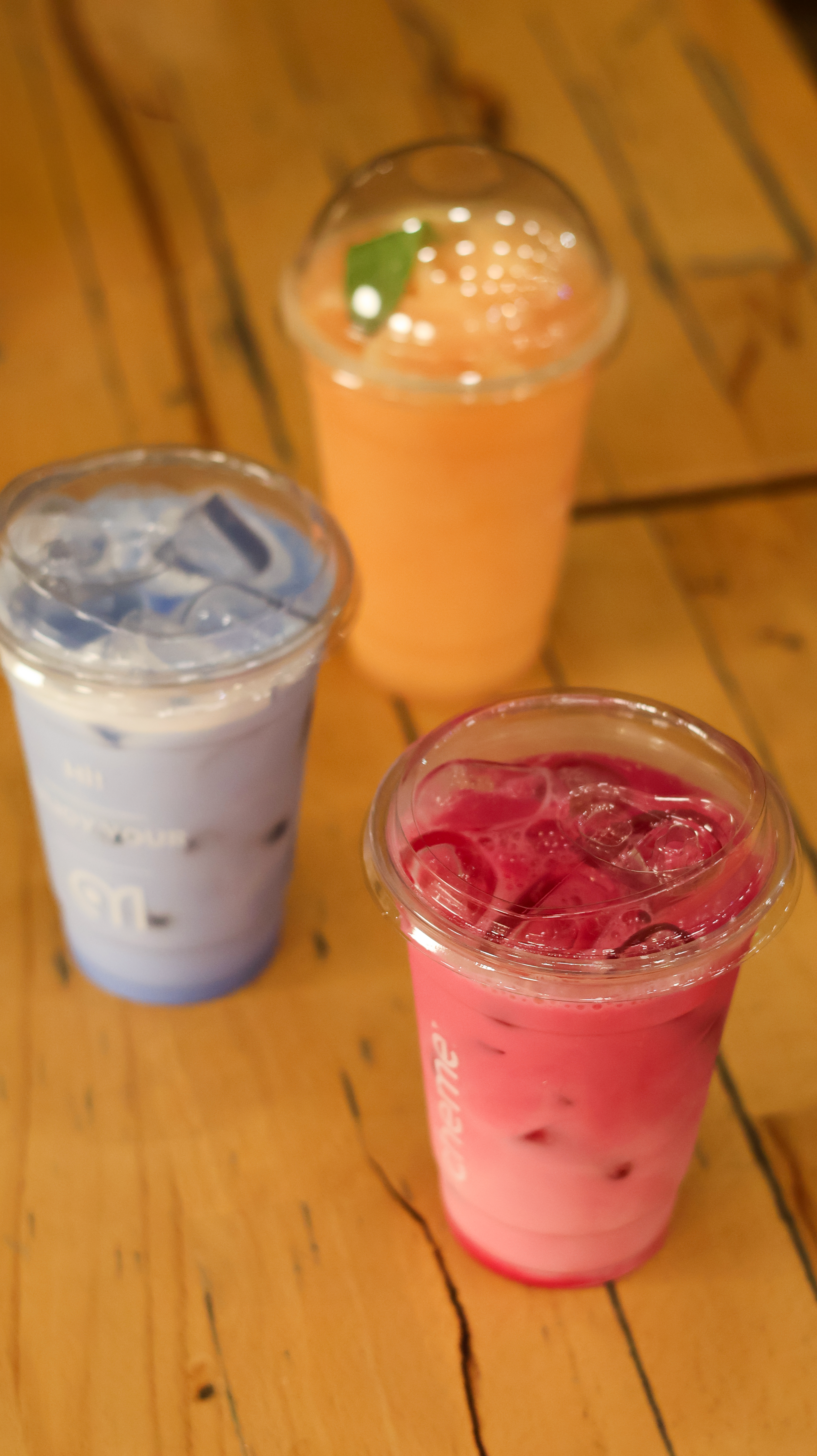 Colorful Iced Drinks on a Wooden Table · Free Stock Photo