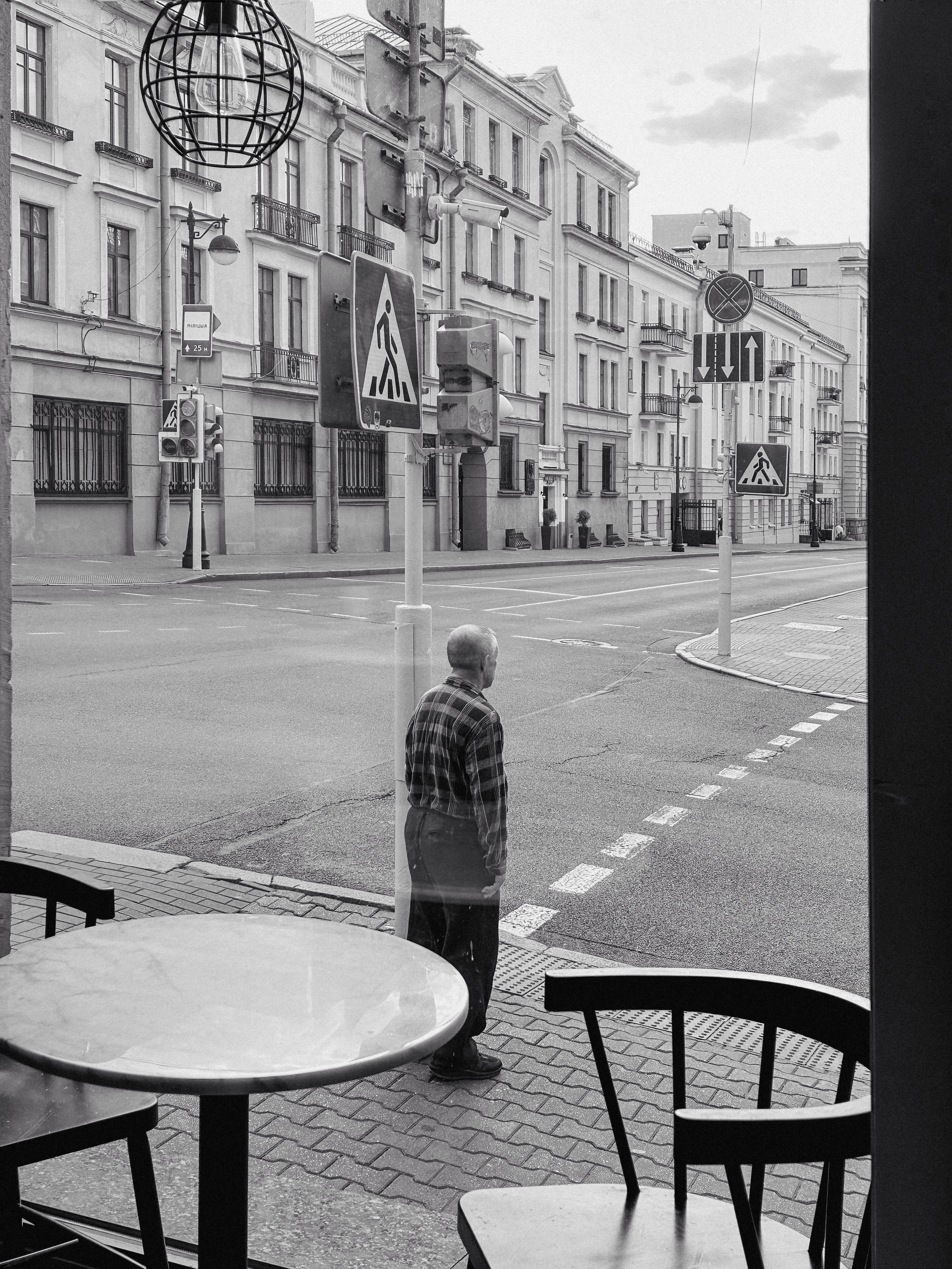 Black and White Street View with Single Pedestrian · Free Stock Photo
