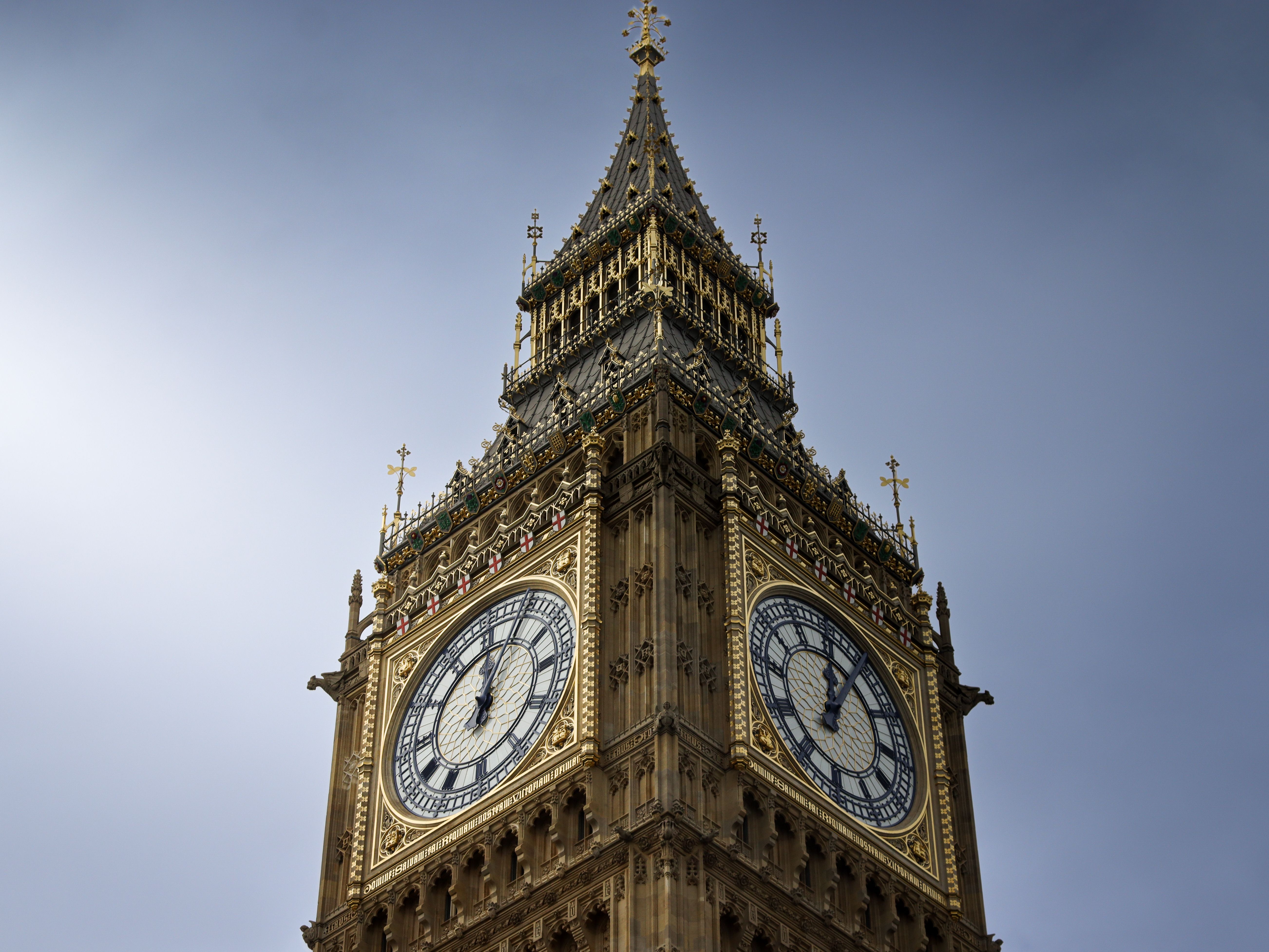 Low Angle View of Clock Tower Against Blue Sky · Free Stock Photo