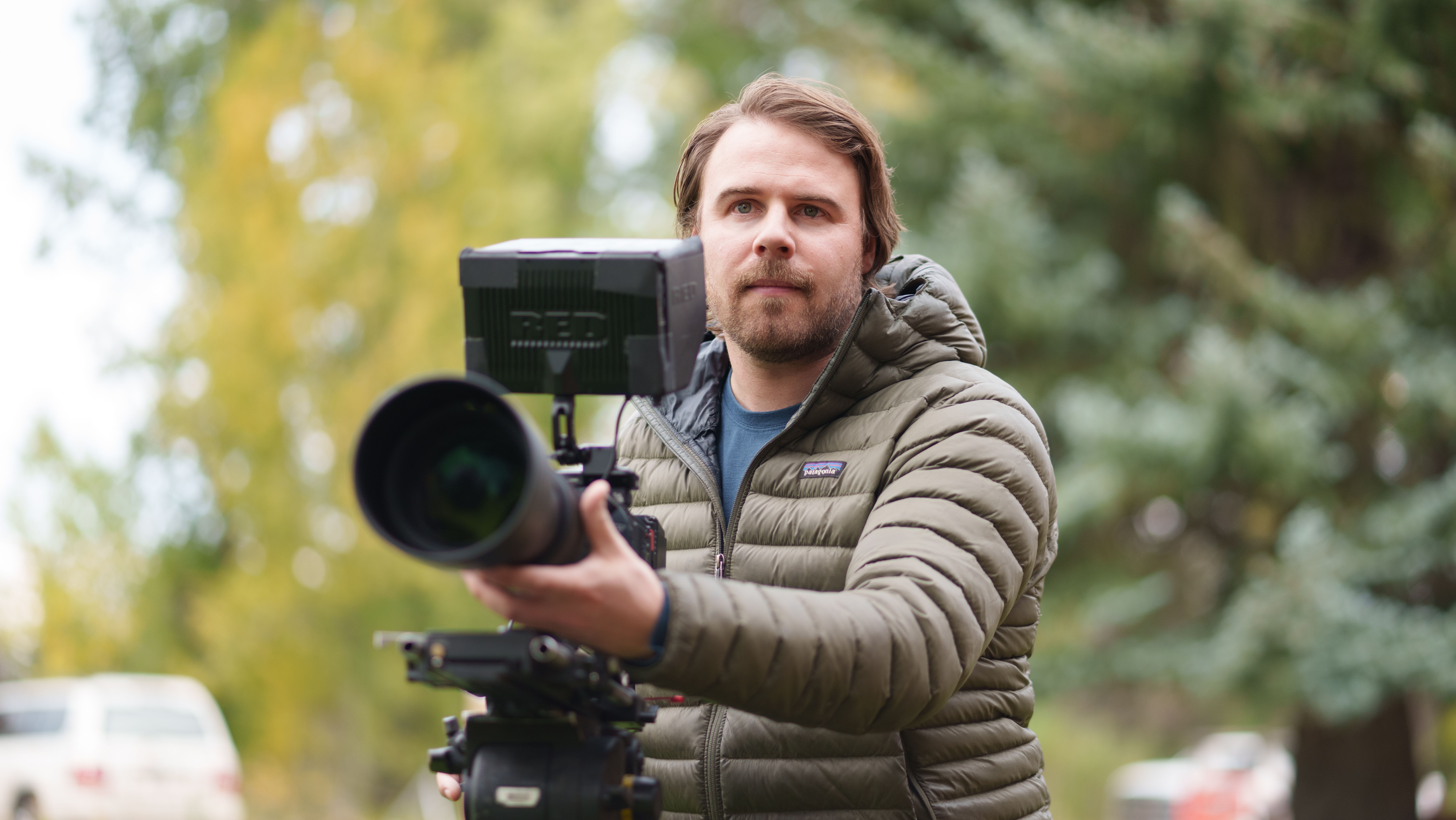 Outdoor Videographer Filming with Professional Camera · Free Stock Photo