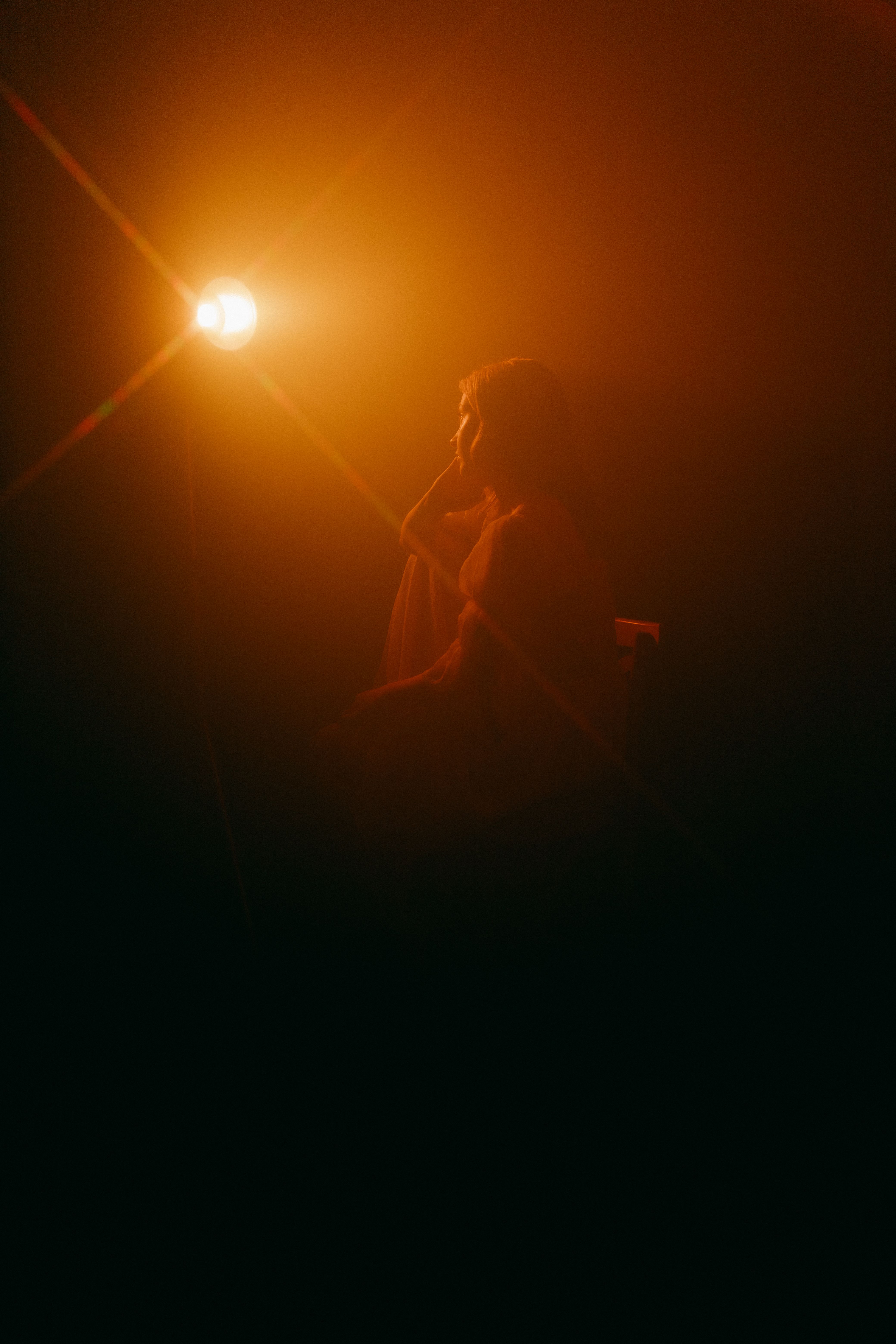 Silhouette of Woman in Dramatic Lighting Setting · Free Stock Photo