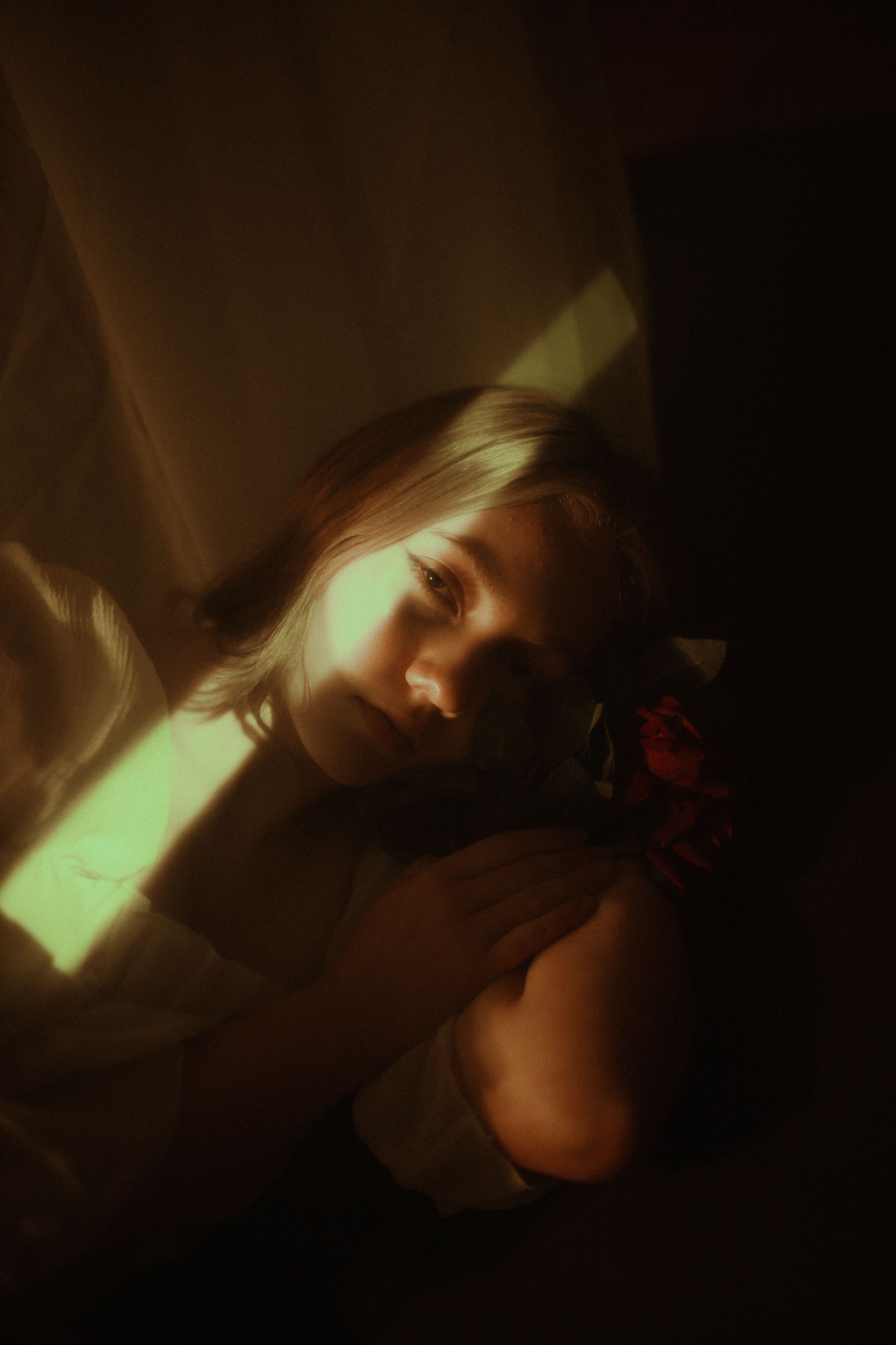 Moody Portrait of a Woman in Dramatic Lighting · Free Stock Photo