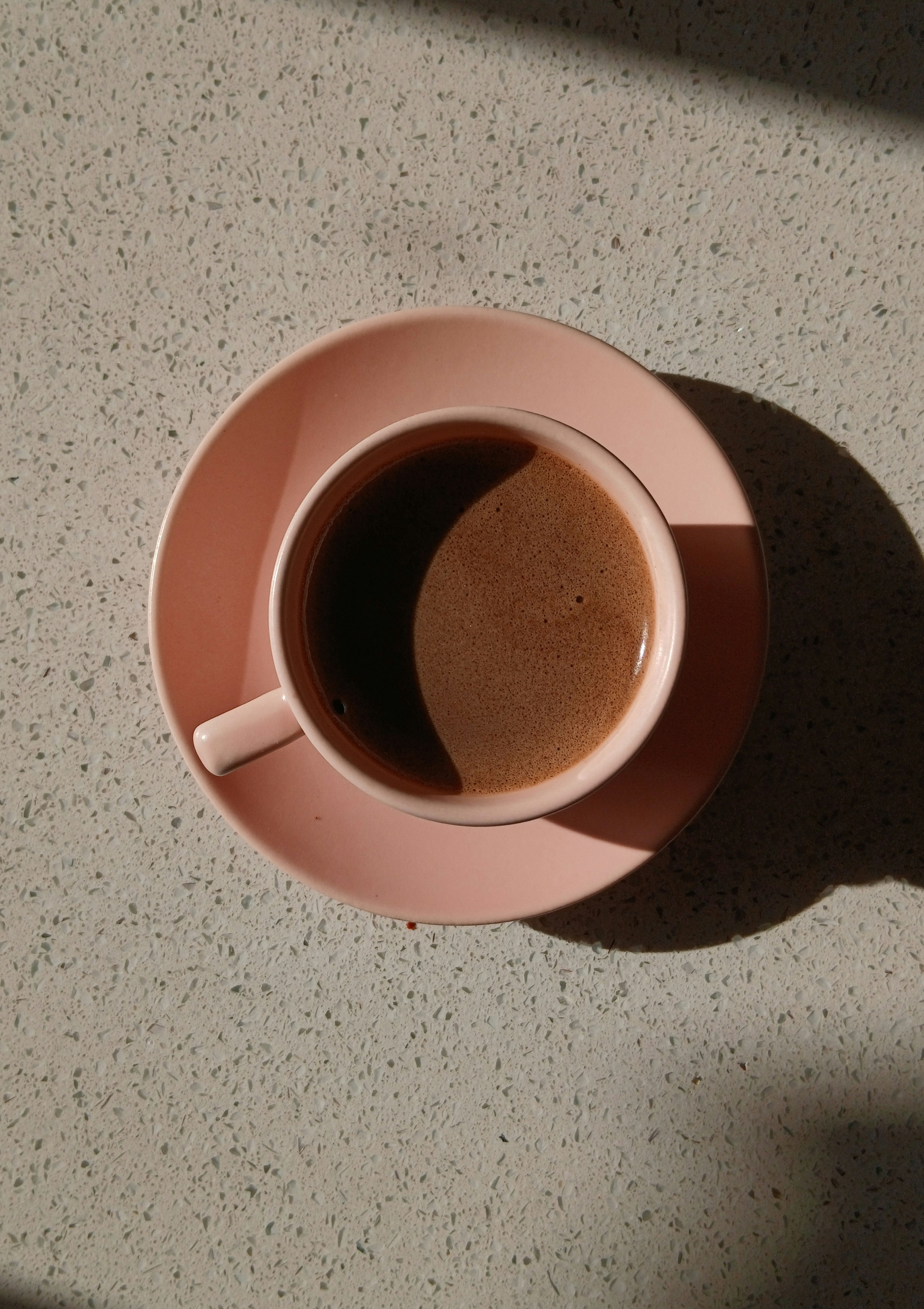 Top View of Coffee in Pink Cup with Shadow · Free Stock Photo