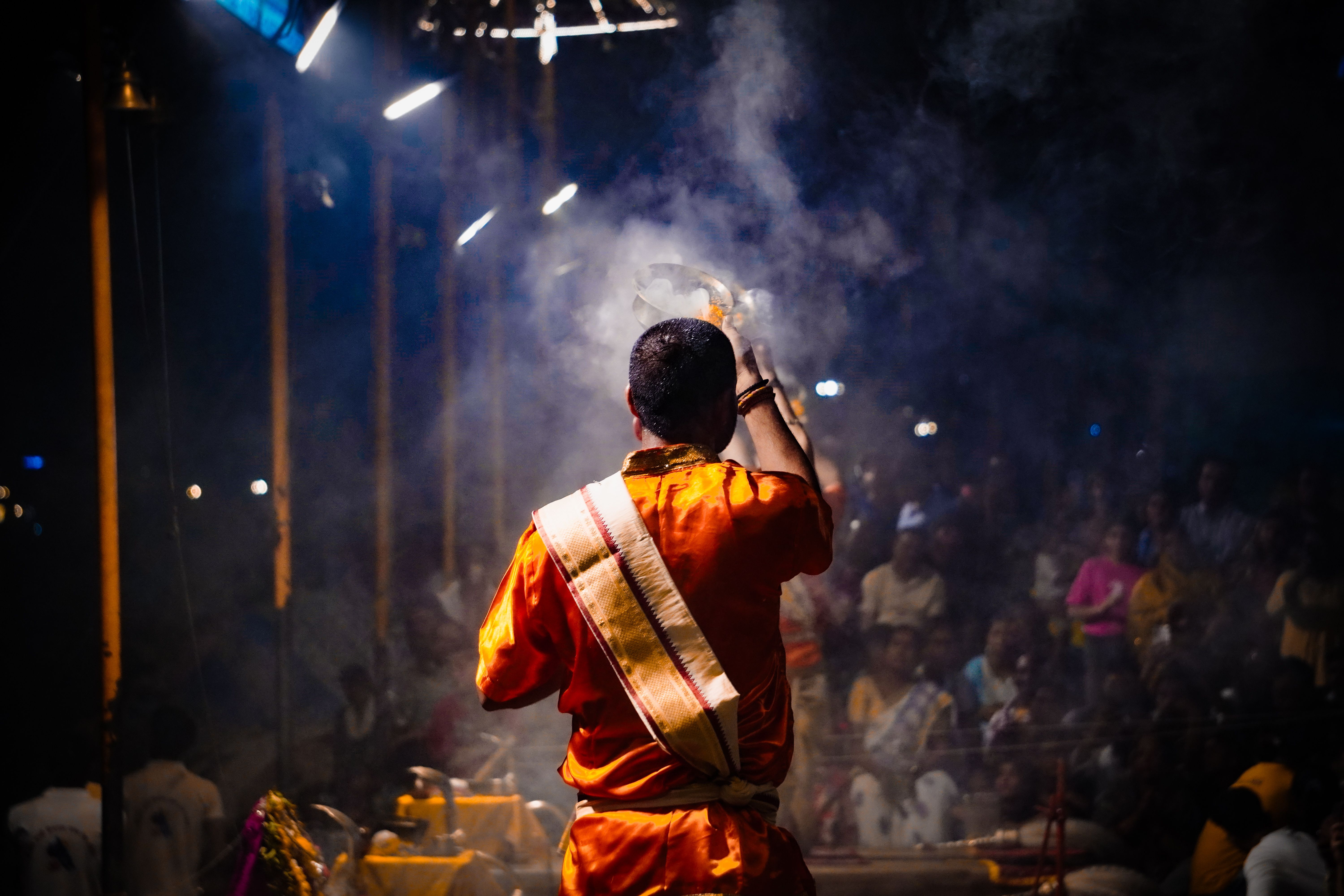 Priest Performing Ritual with Incense at Night Ceremony · Free Stock Photo