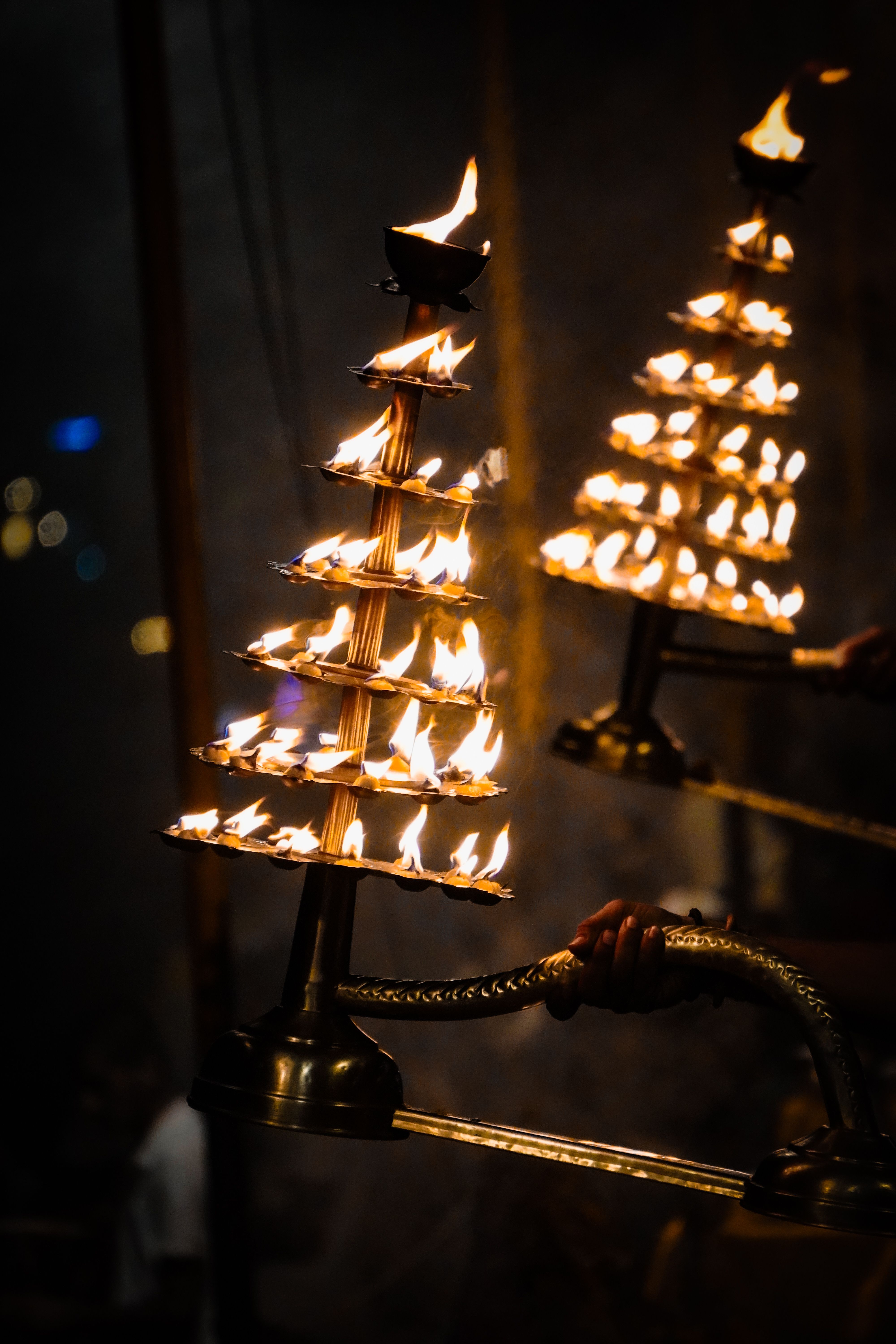 Ceremonial Brass Oil Lamps with Flames · Free Stock Photo