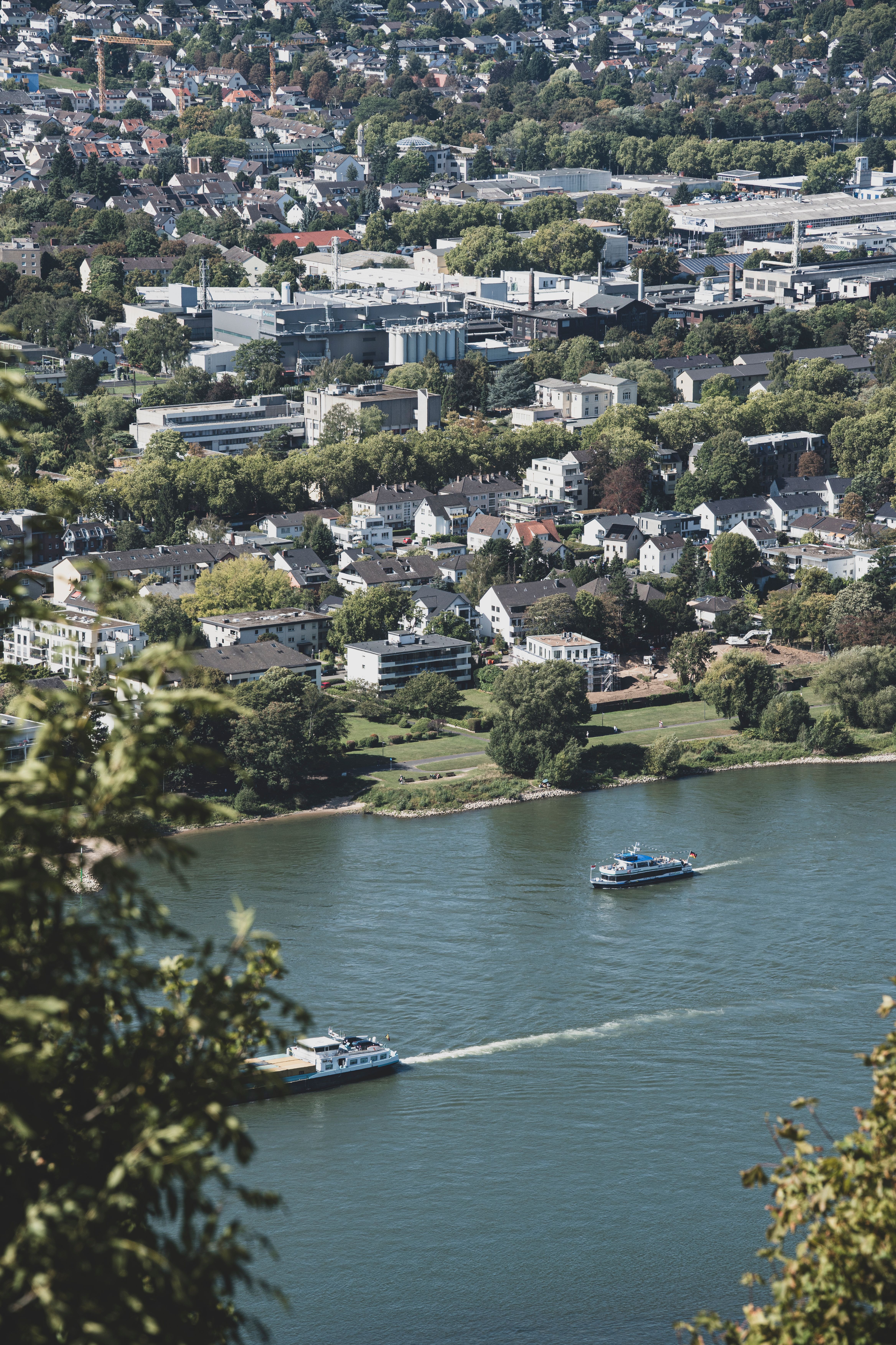 Aerial View of Scenic Riverside Town and Boats · Free Stock Photo