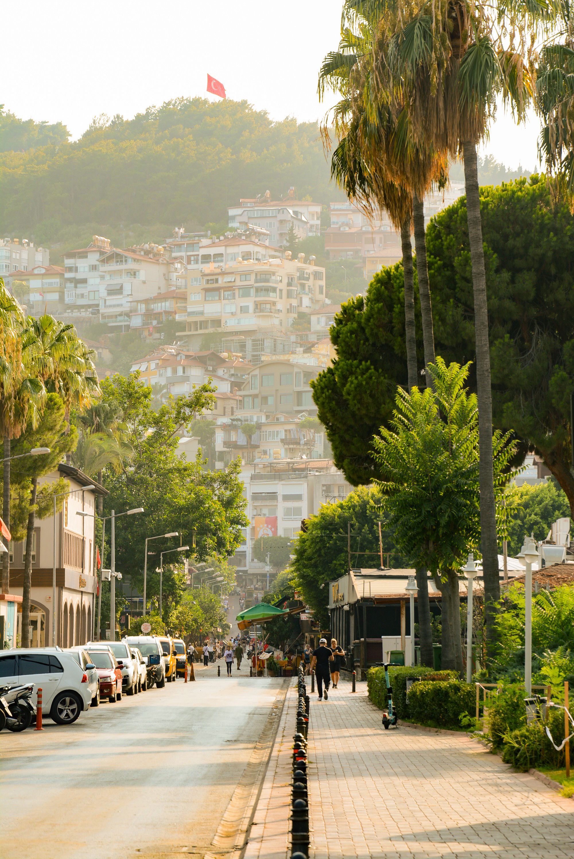 Scenic Street View with Hillside Buildings · Free Stock Photo