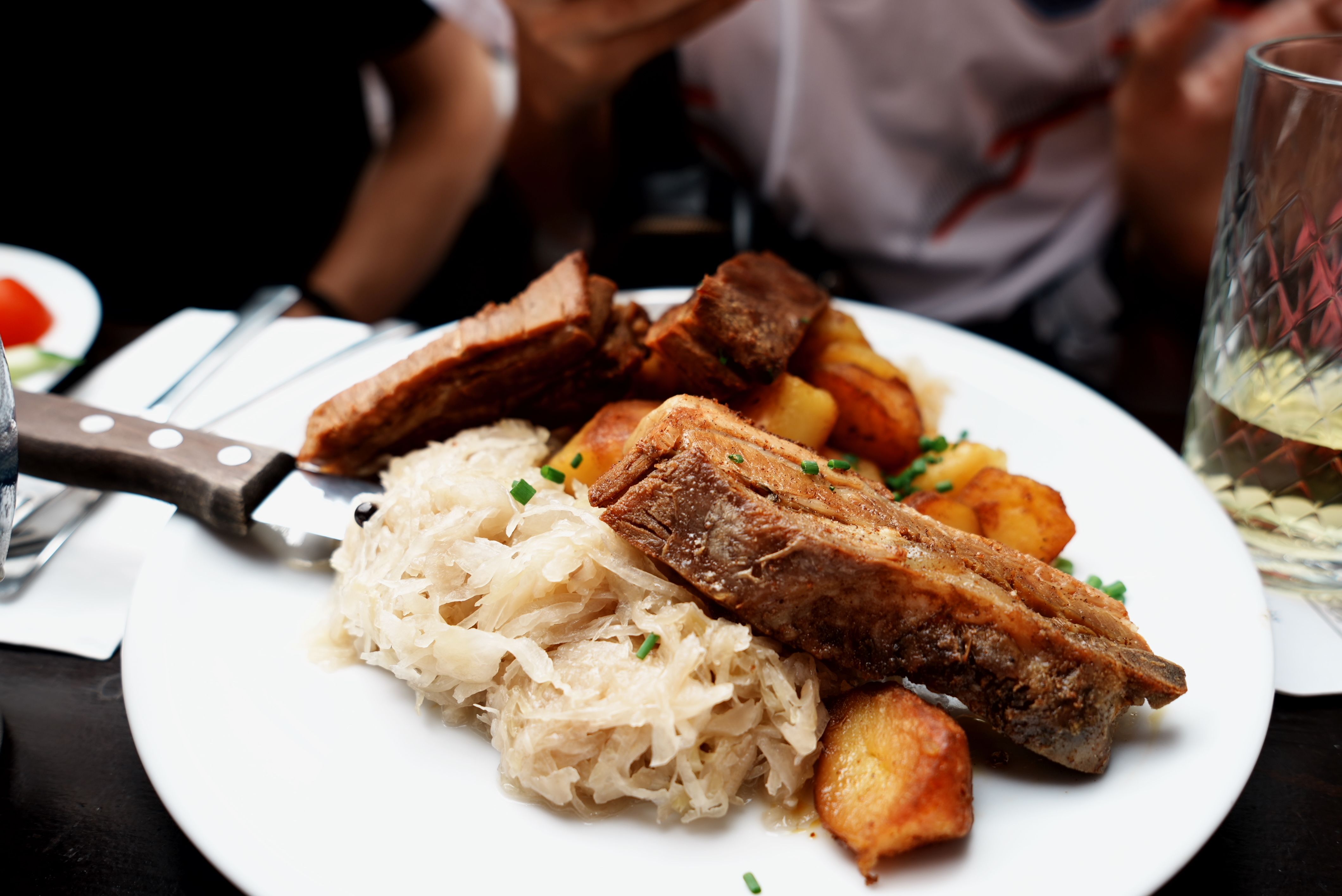 Traditional German Meal with Sauerkraut and Roast Pork · Free Stock Photo
