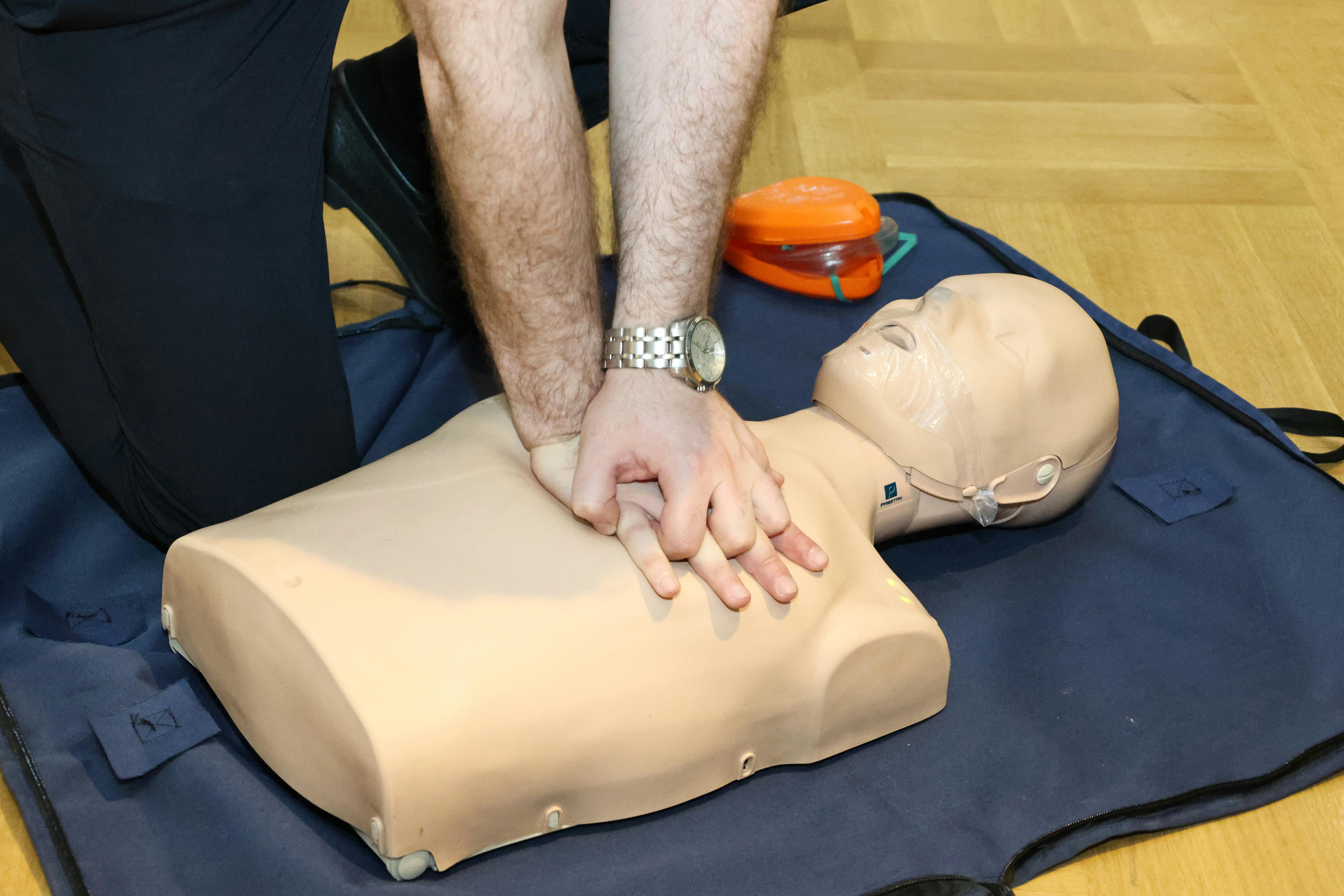 CPR Training with Mannequin Dummy Indoors · Free Stock Photo