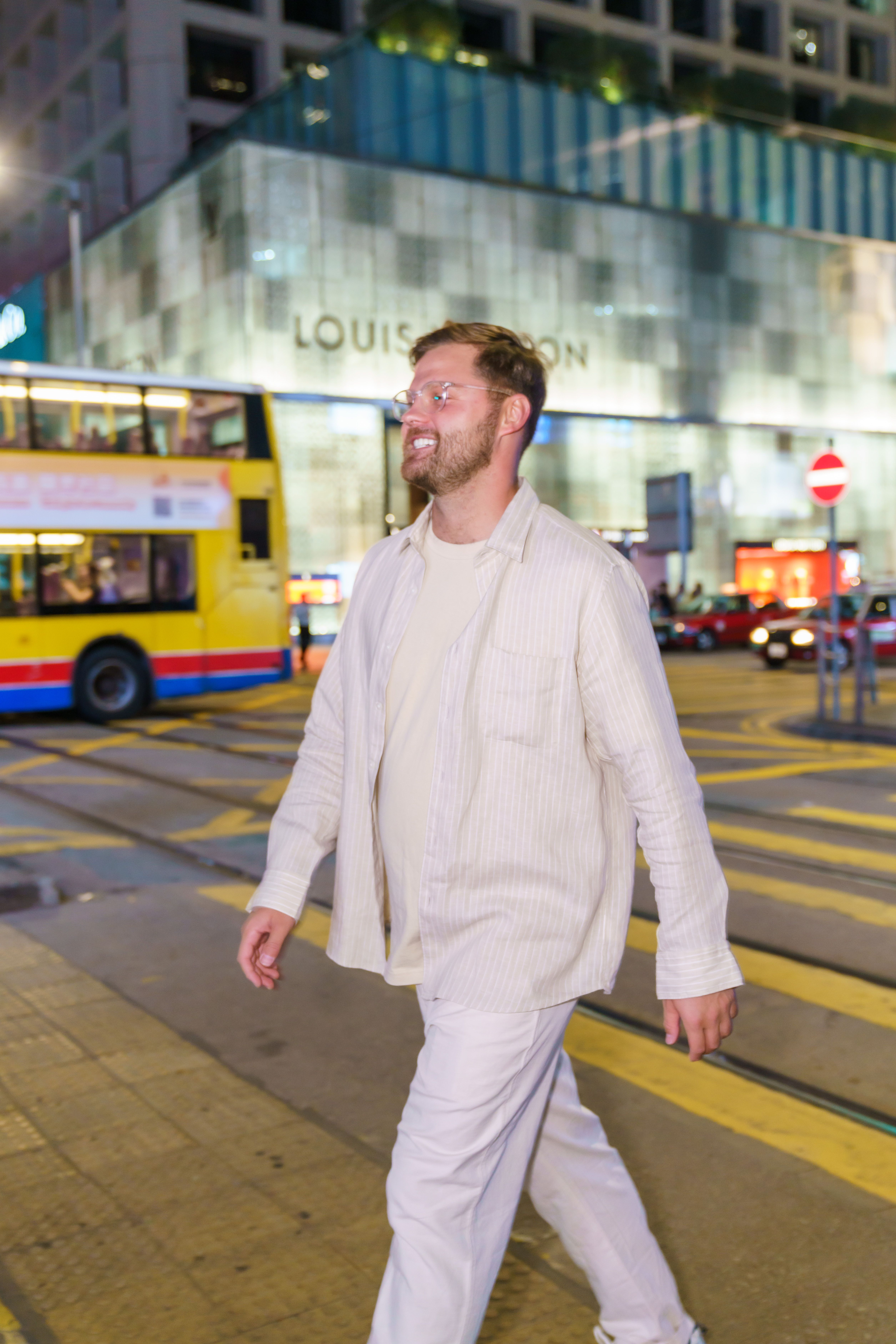 Man Walking in City Near Luxury Storefront · Free Stock Photo