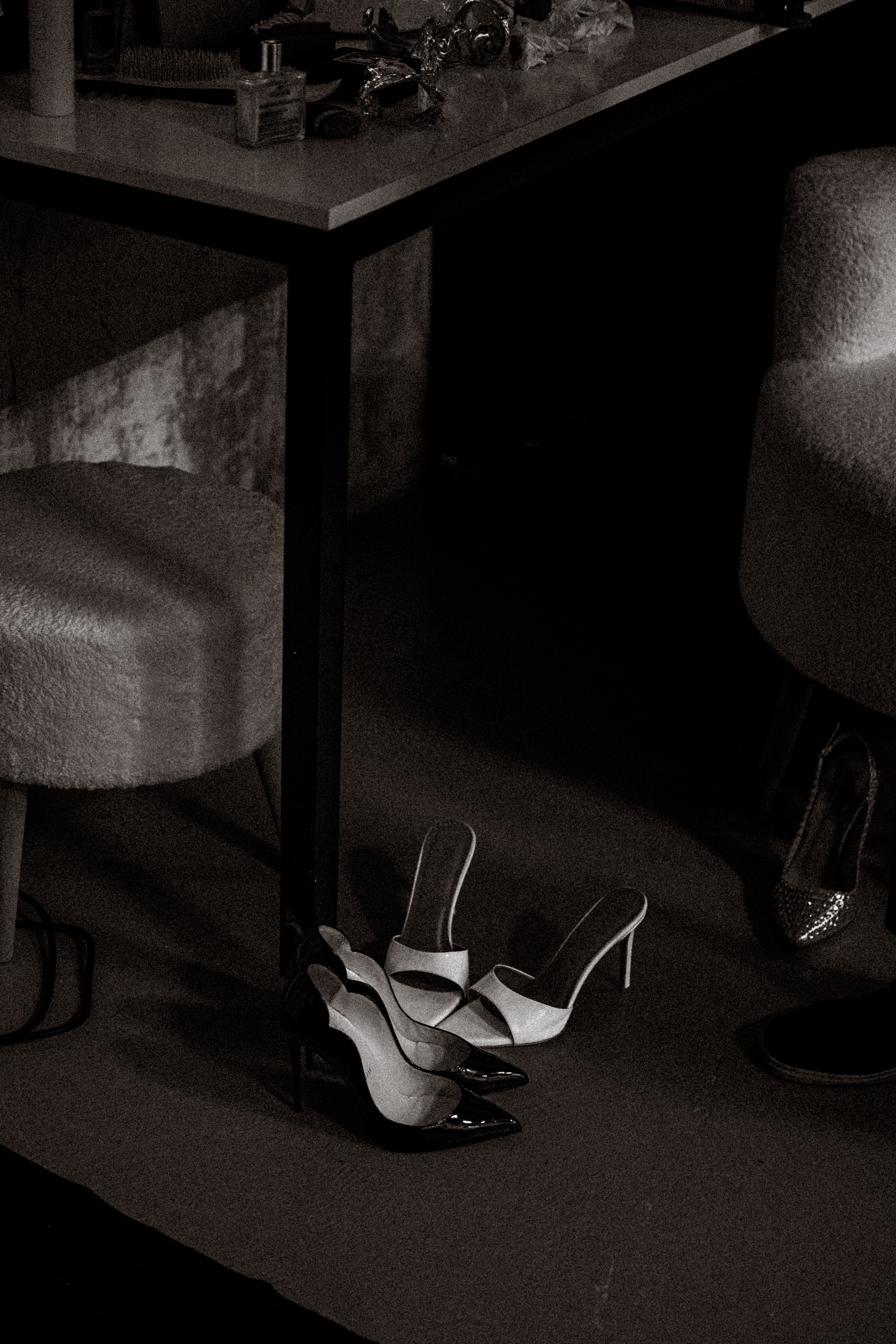 Stylish Shoes Under Dressing Table in Dim Light · Free Stock Photo