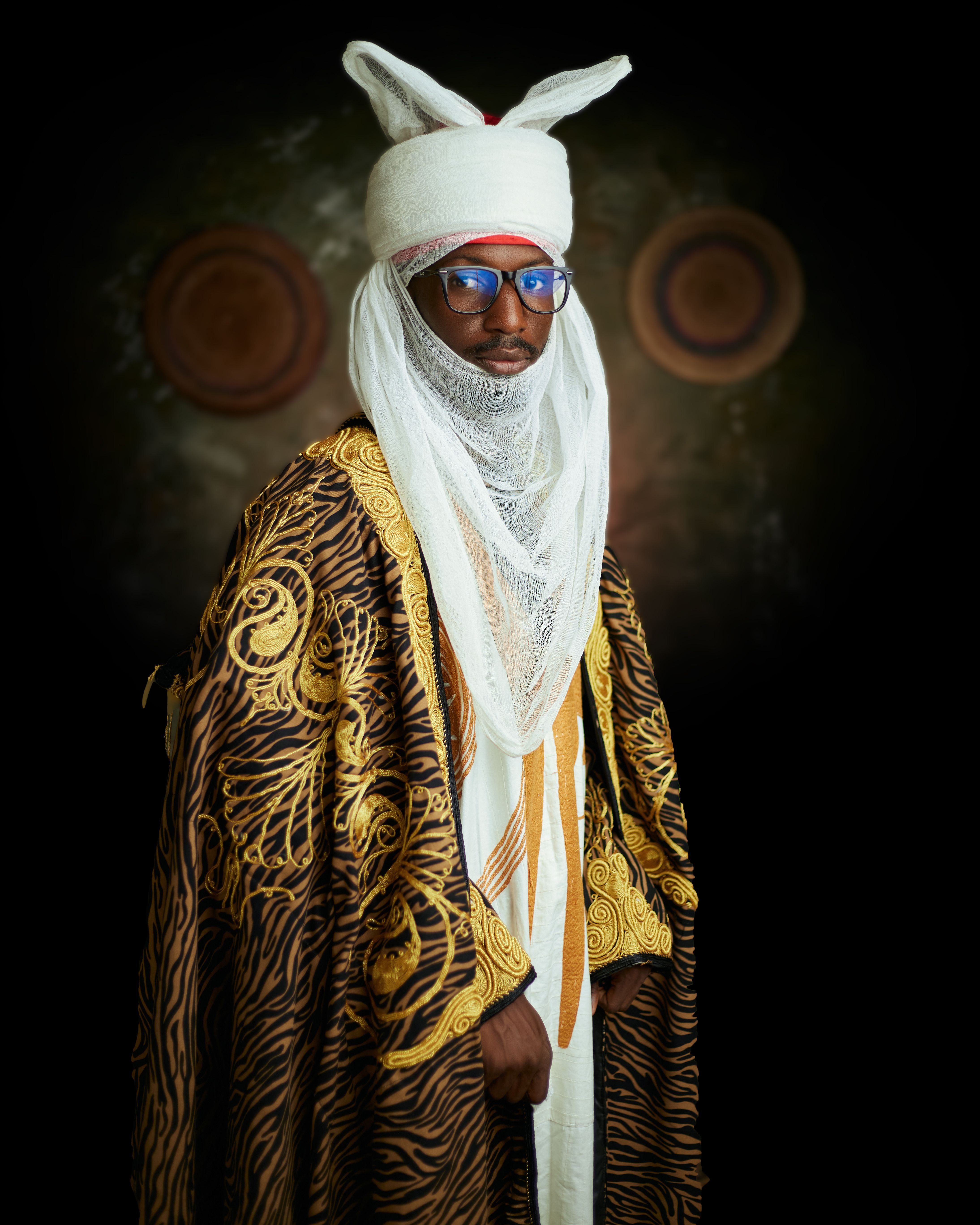 Traditional African Attire with Ornate Robe and Turban · Free Stock Photo