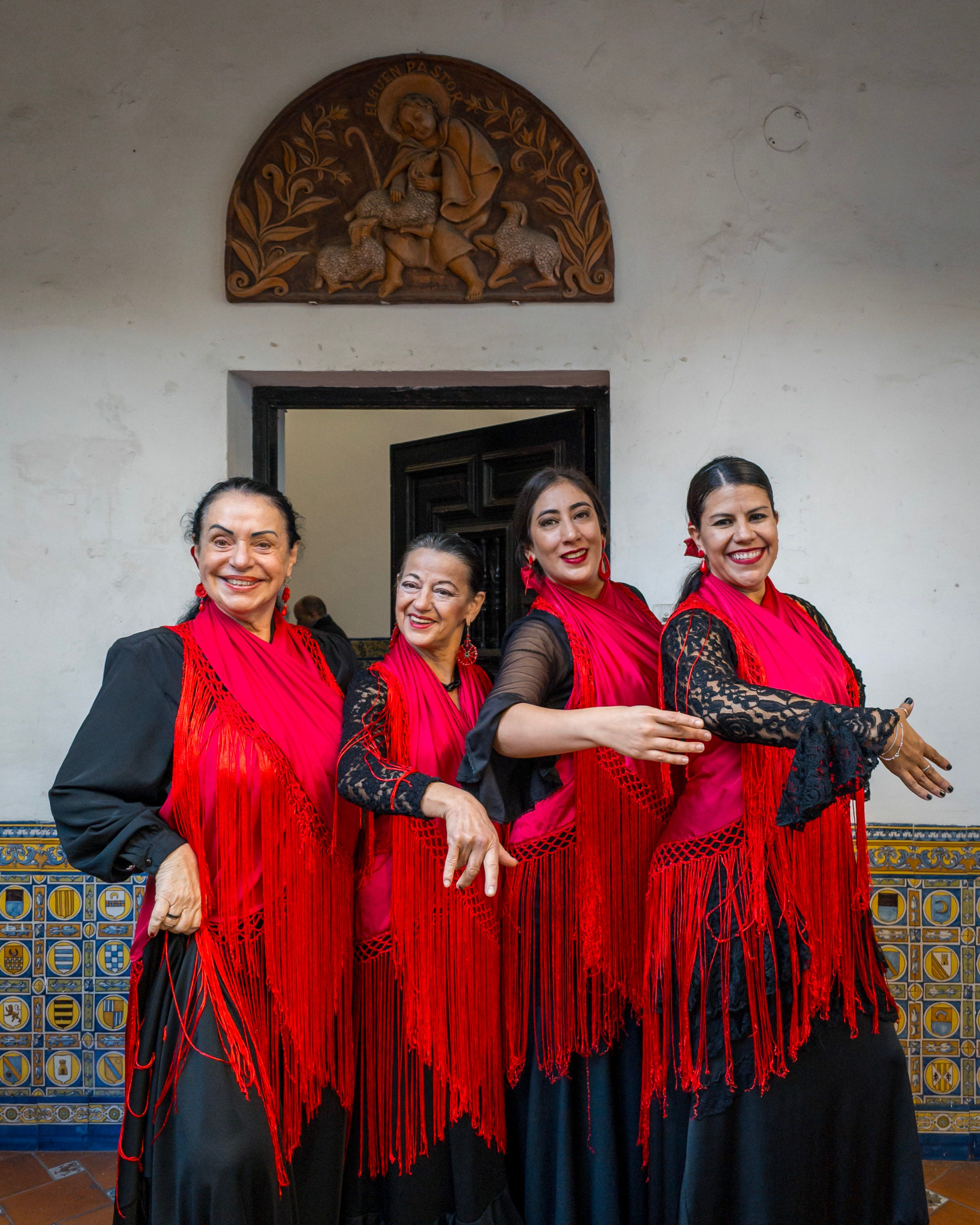 Four Flamenco Dancers in Vibrant Costumes Performing · Free Stock Photo