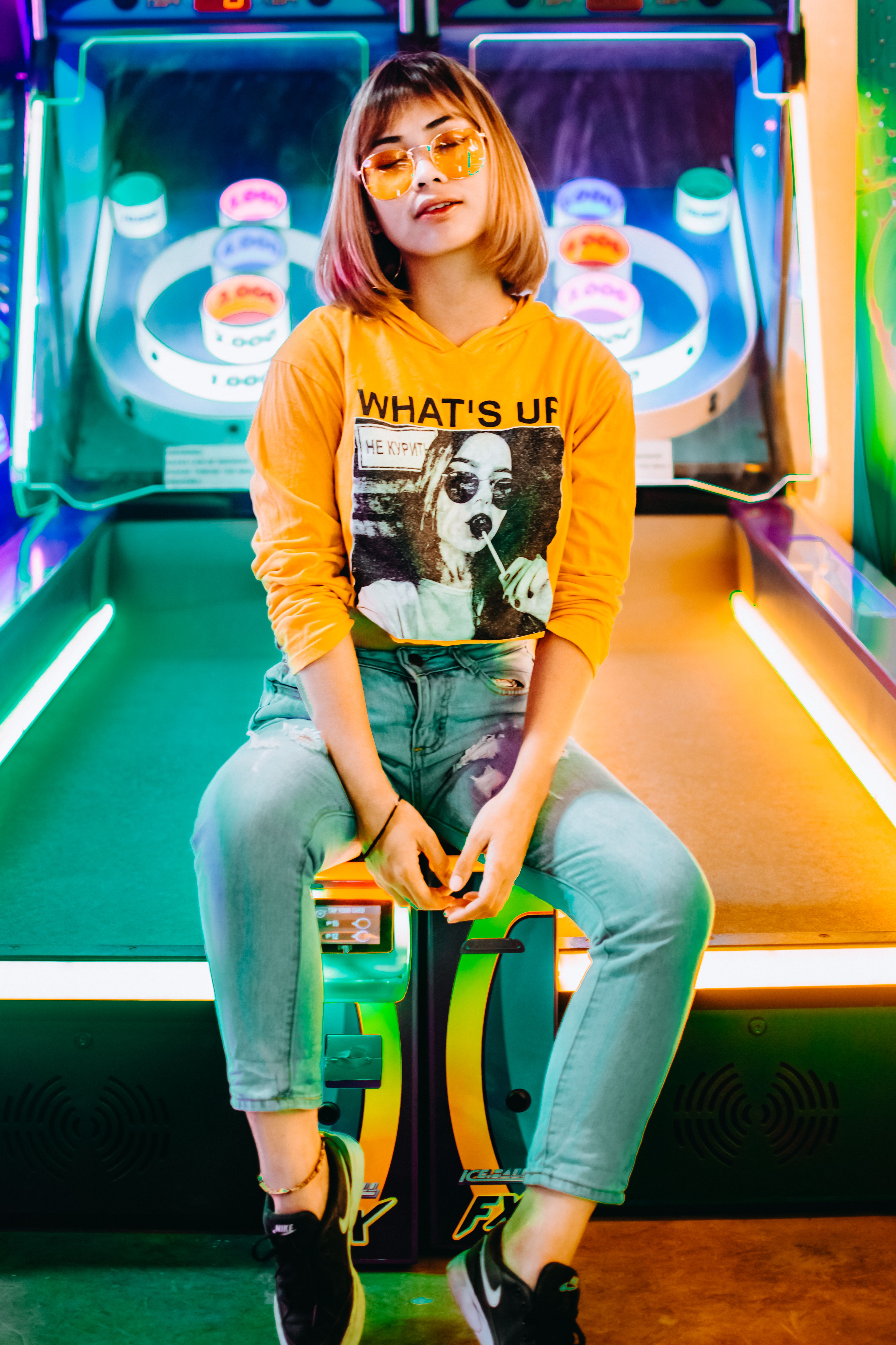 Trendy Teen in Arcade with Neon Lights · Free Stock Photo