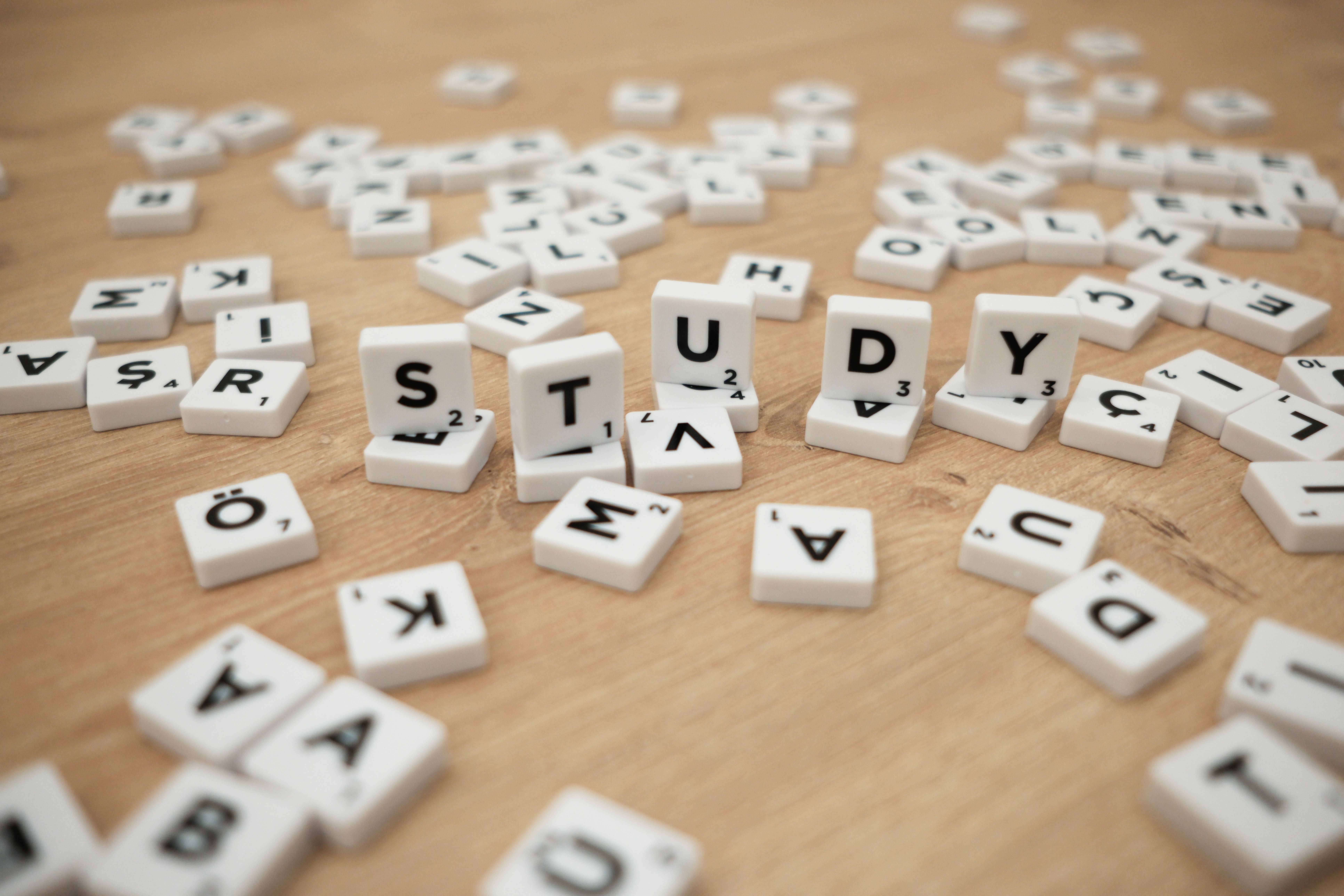 Scatter of Letter Tiles Spelling 'Study' on Table · Free Stock Photo
