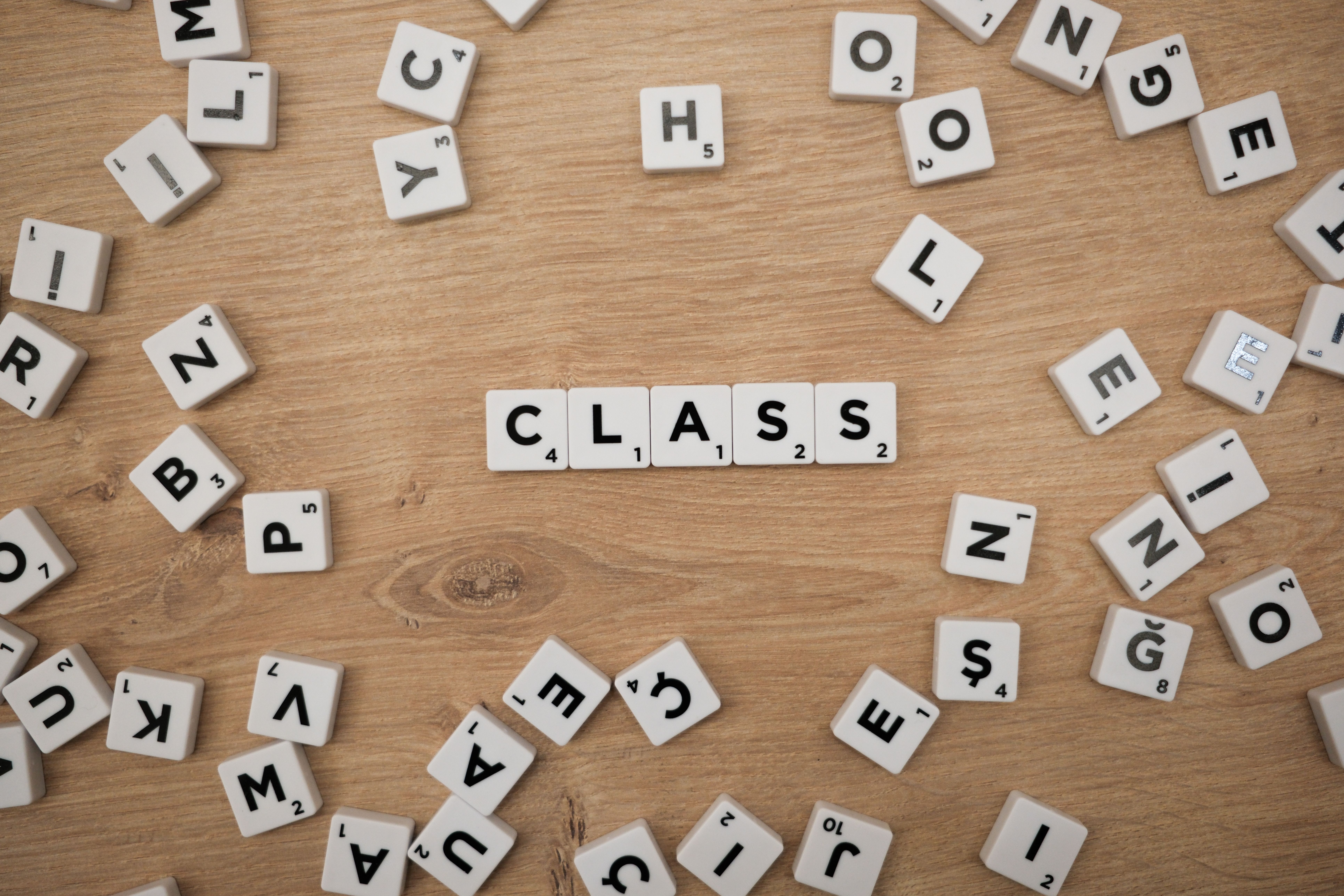 Scrabble Tiles Spelling 'Class' on Wooden Background · Free Stock Photo