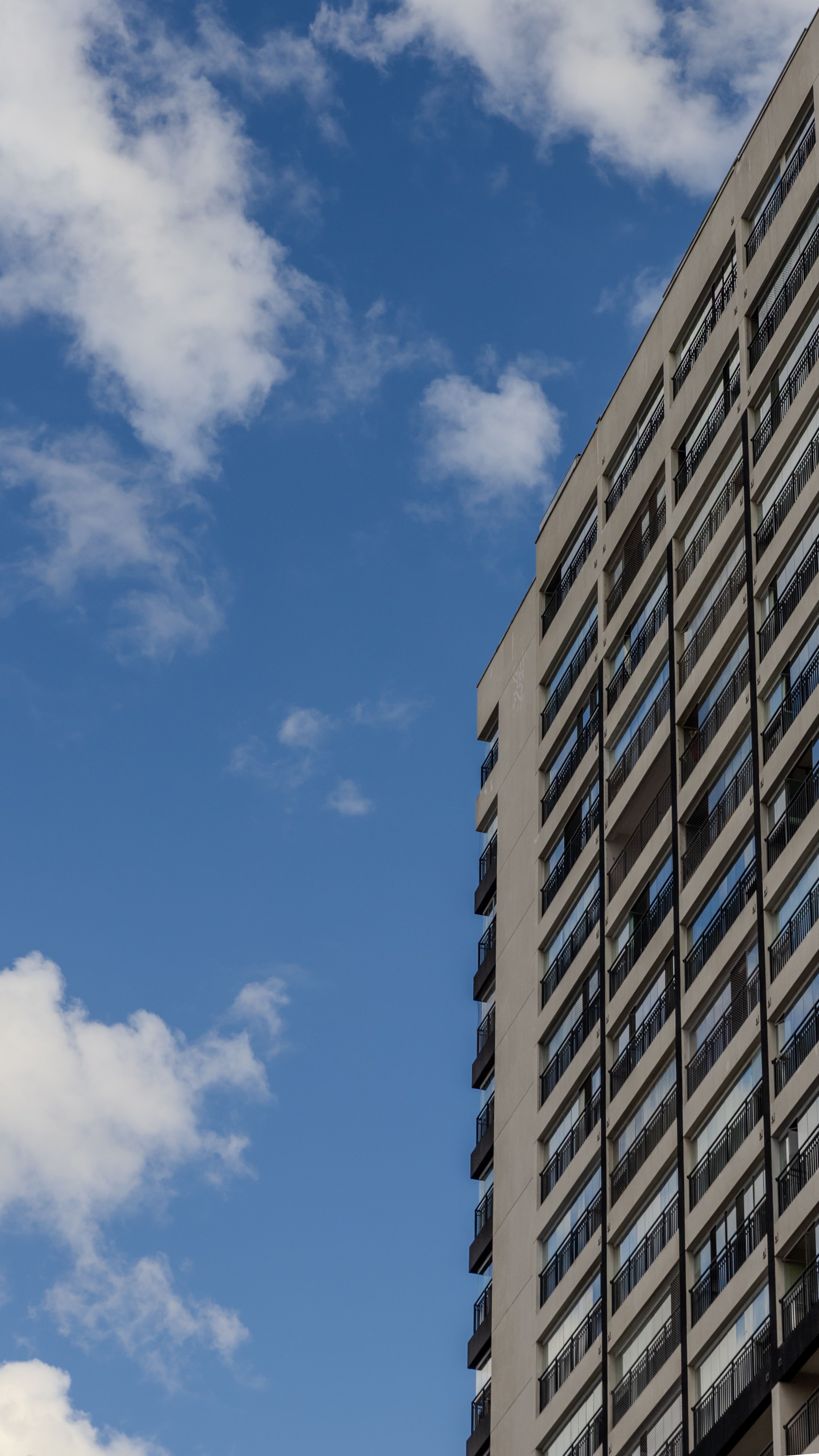 High-Rise Building Against Blue Sky · Free Stock Photo