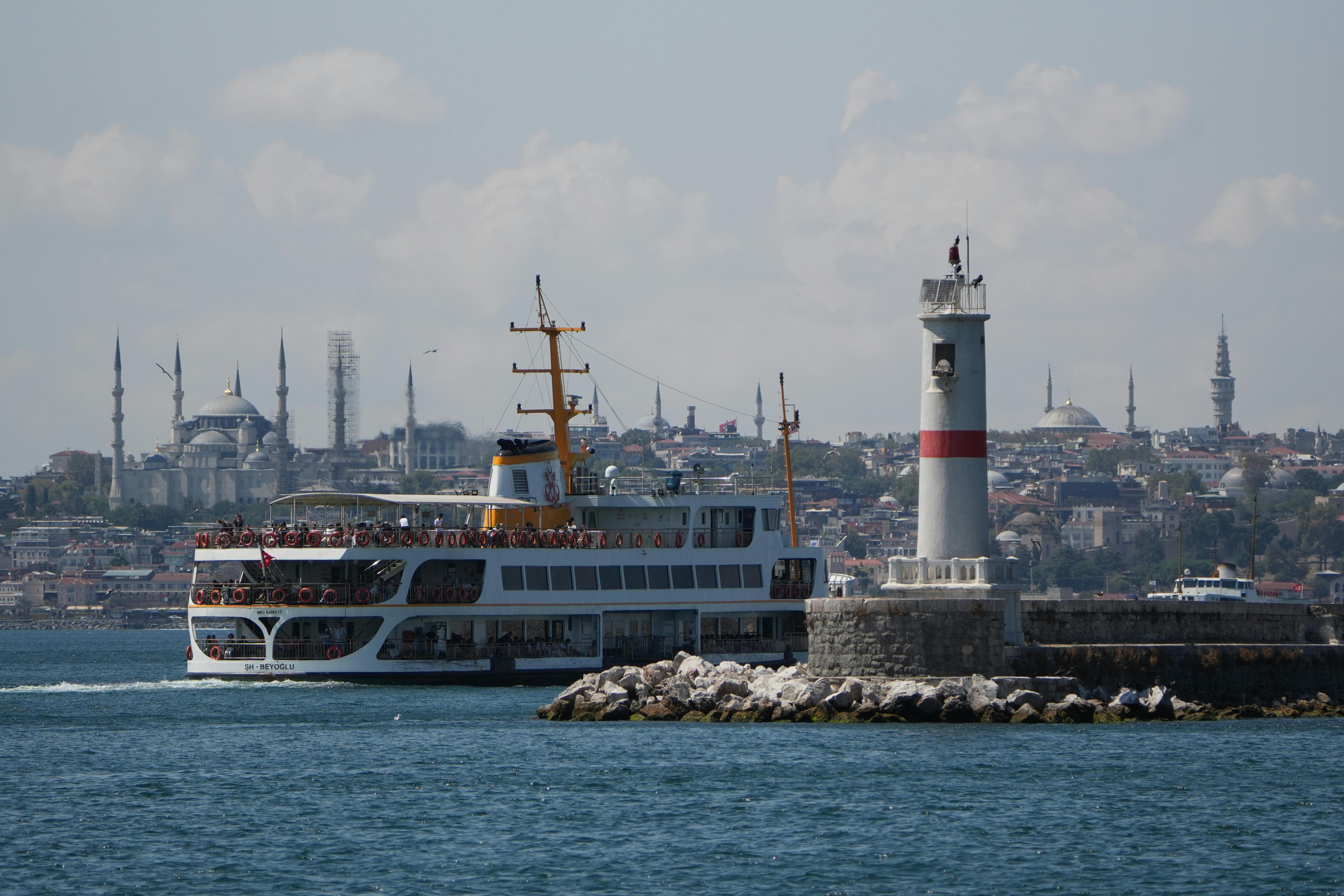 Scenic View of Ferry Near Istanbul Lighthouse · Free Stock Photo